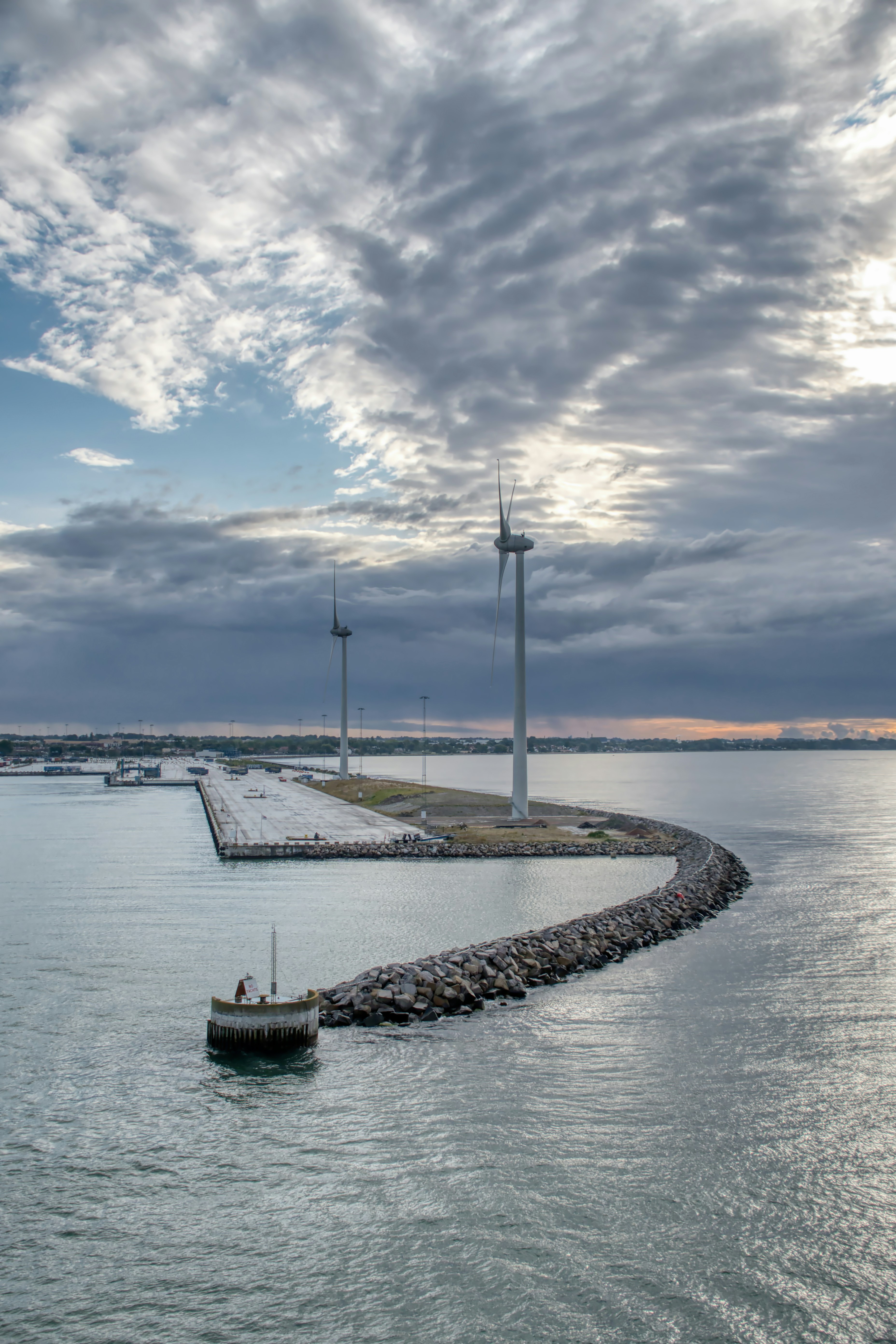Wind Turbine Gate: A Serpentine Breakwater Reaches the Horizon