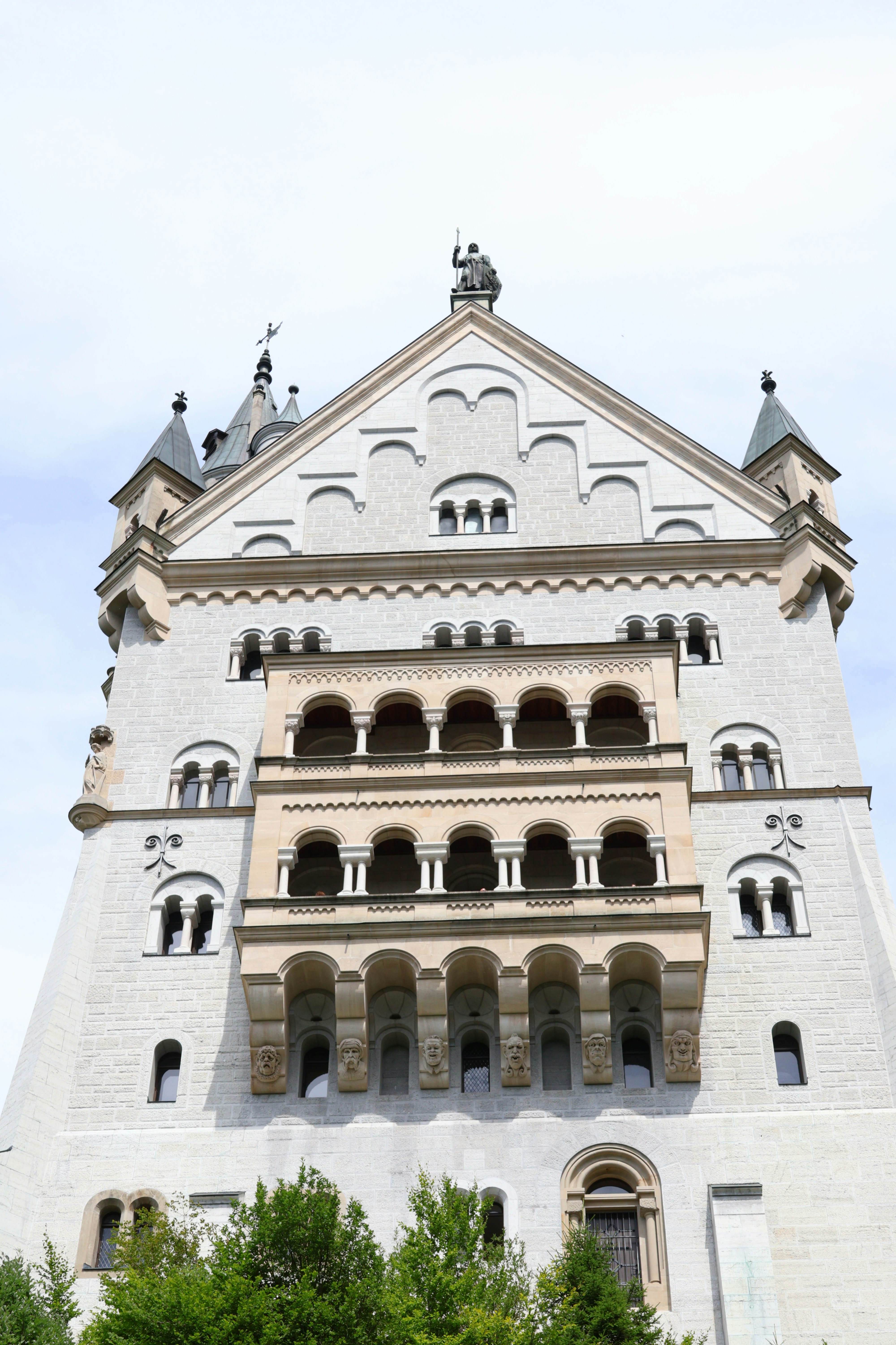 Arched Ascendancy: Towering Stone with Layered Arcades and a Summit Statue