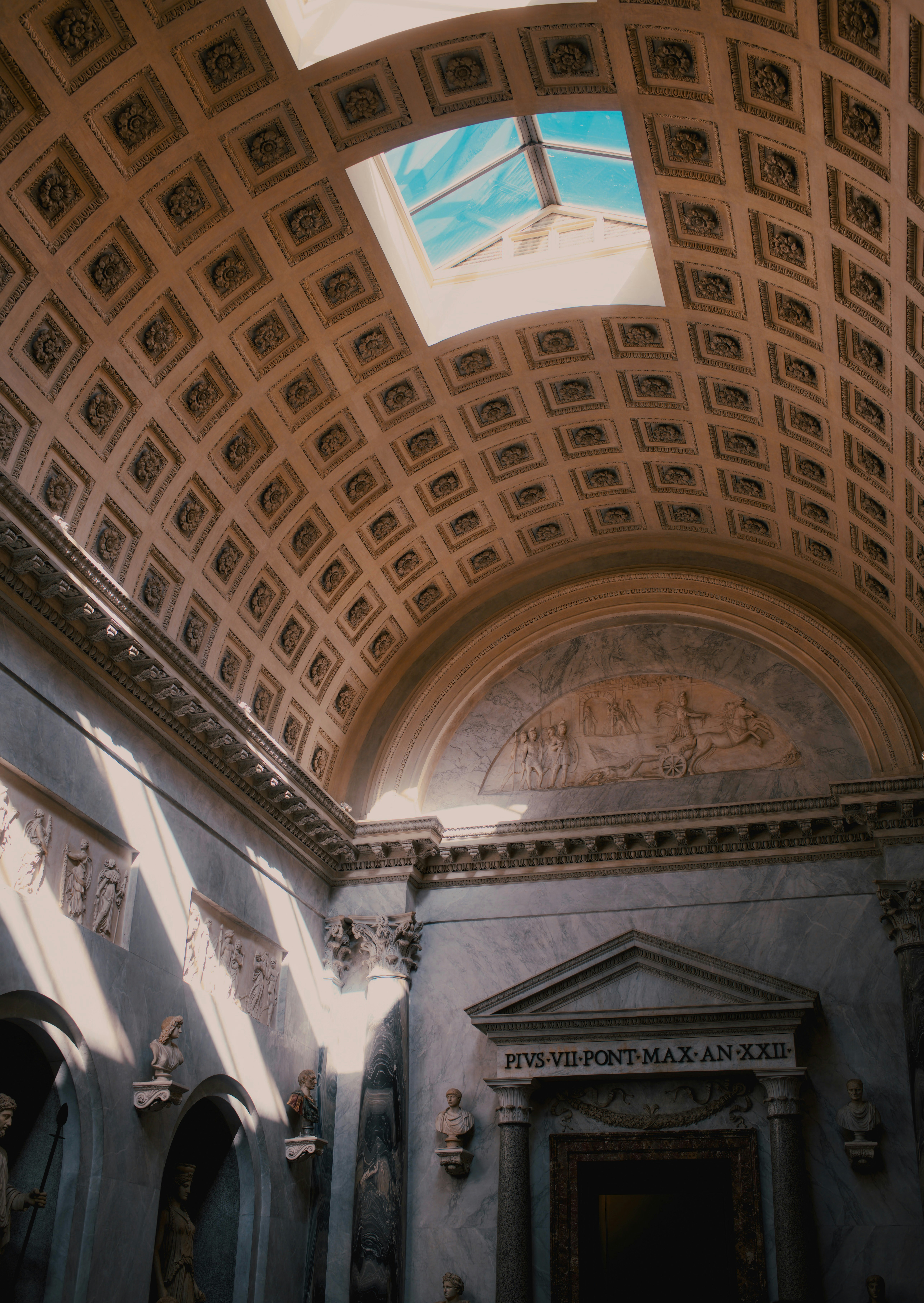 Oculus Above Marble: Light Floods a Coffered Dome