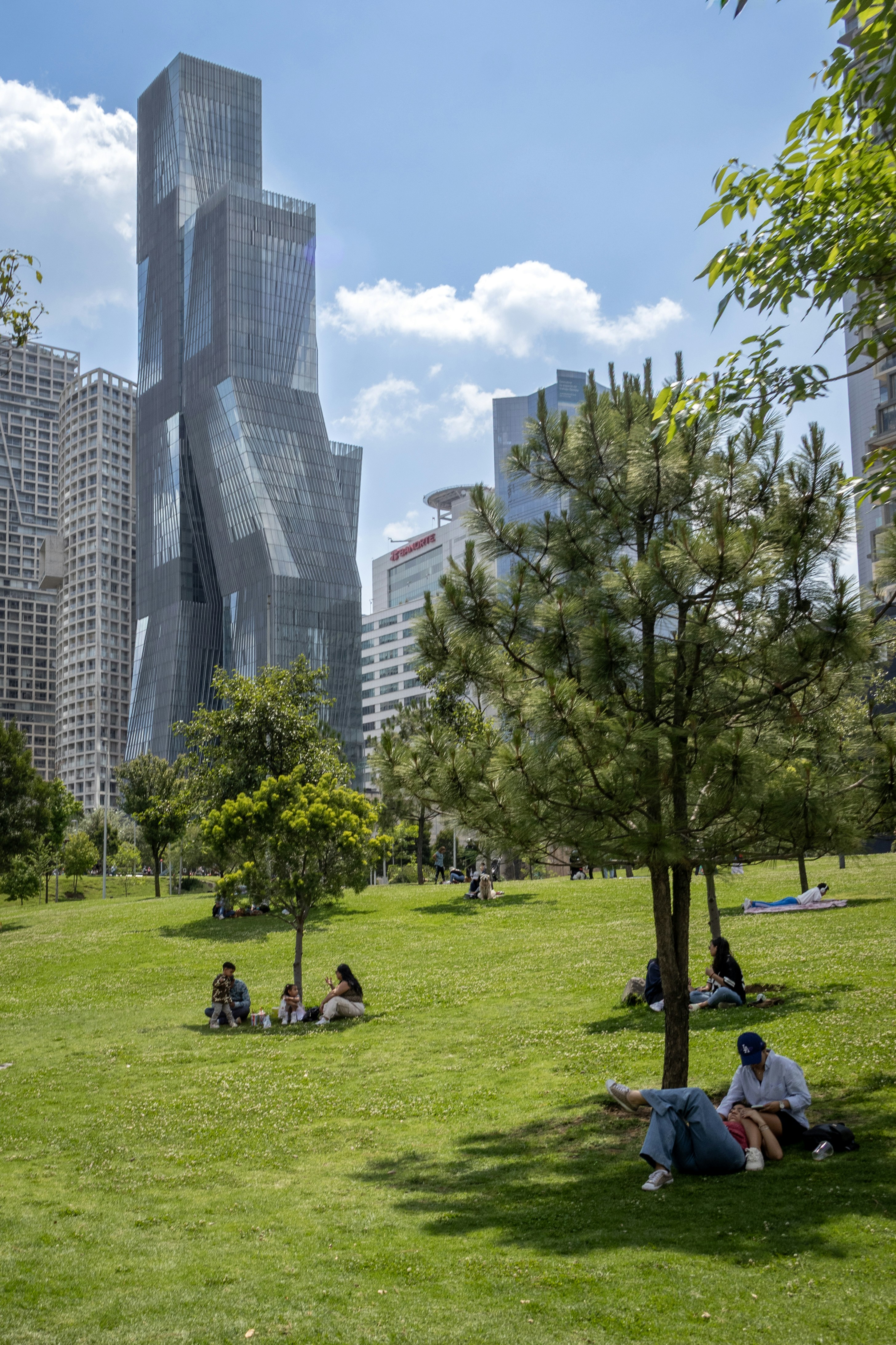 Glass Monoliths Over a Sunlit City Park
