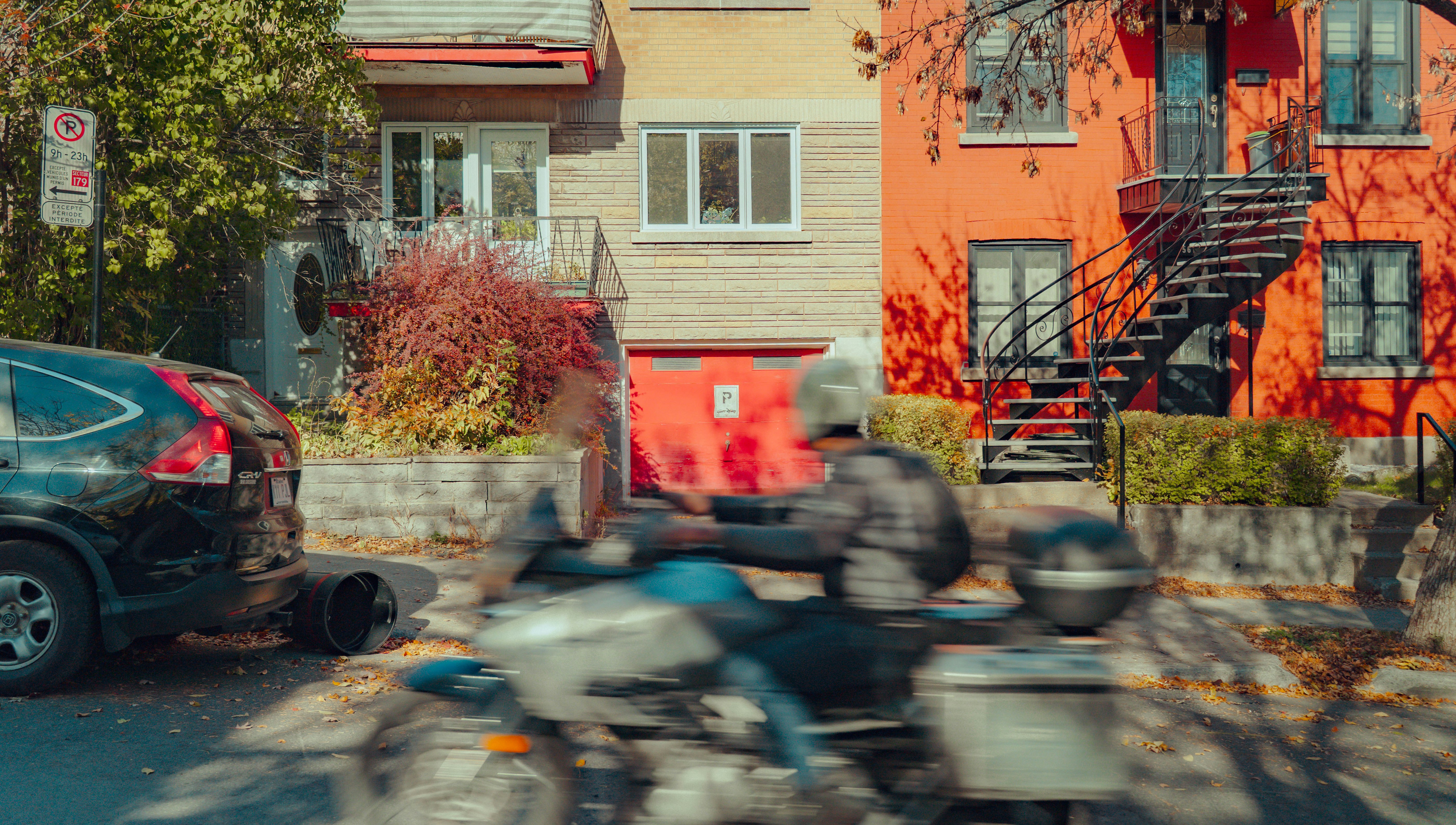 Red Door on a Blur of Motion: A Street Scene in Transit