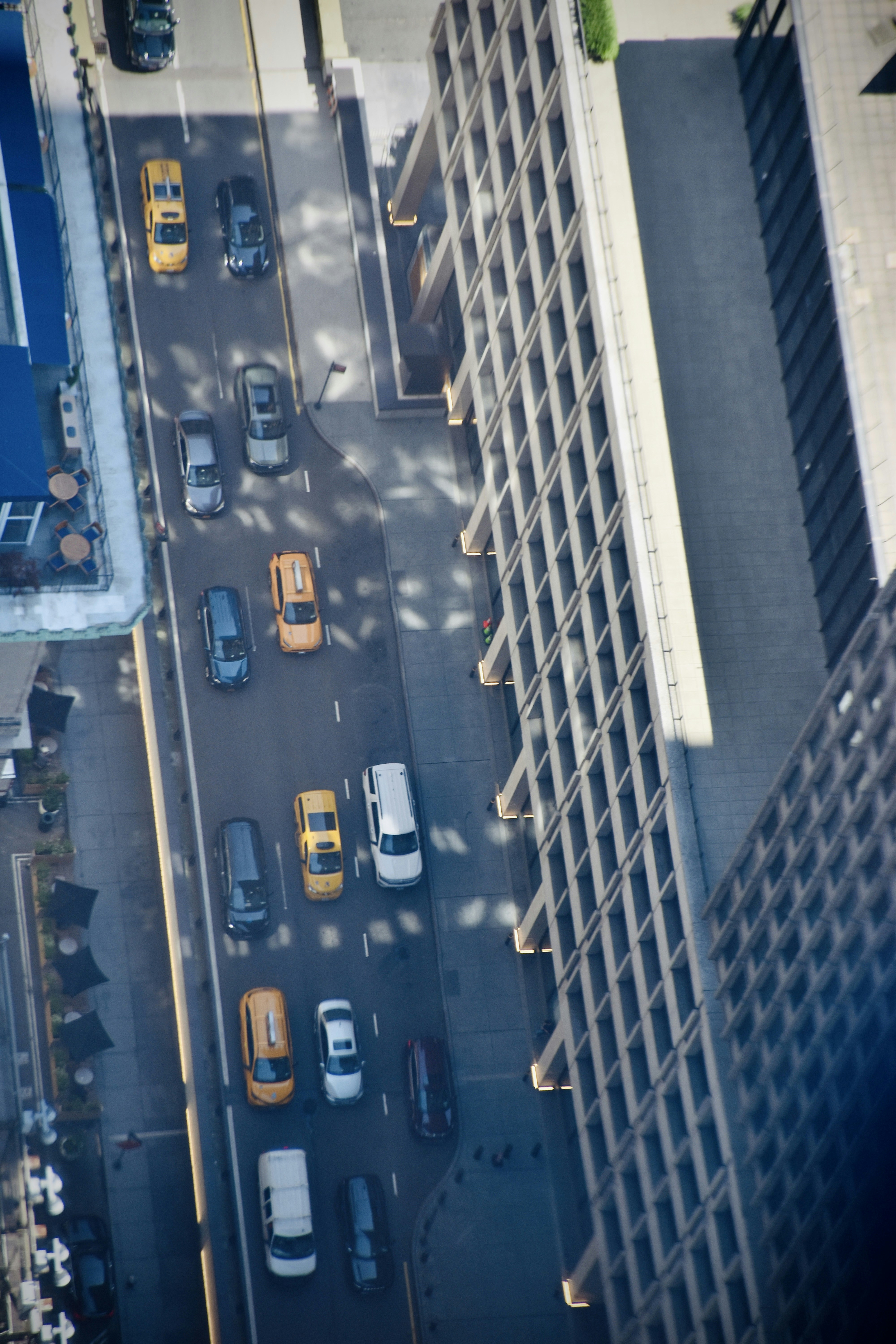Vertical Urban Traffic: Aerial View Through a Glass Canyon