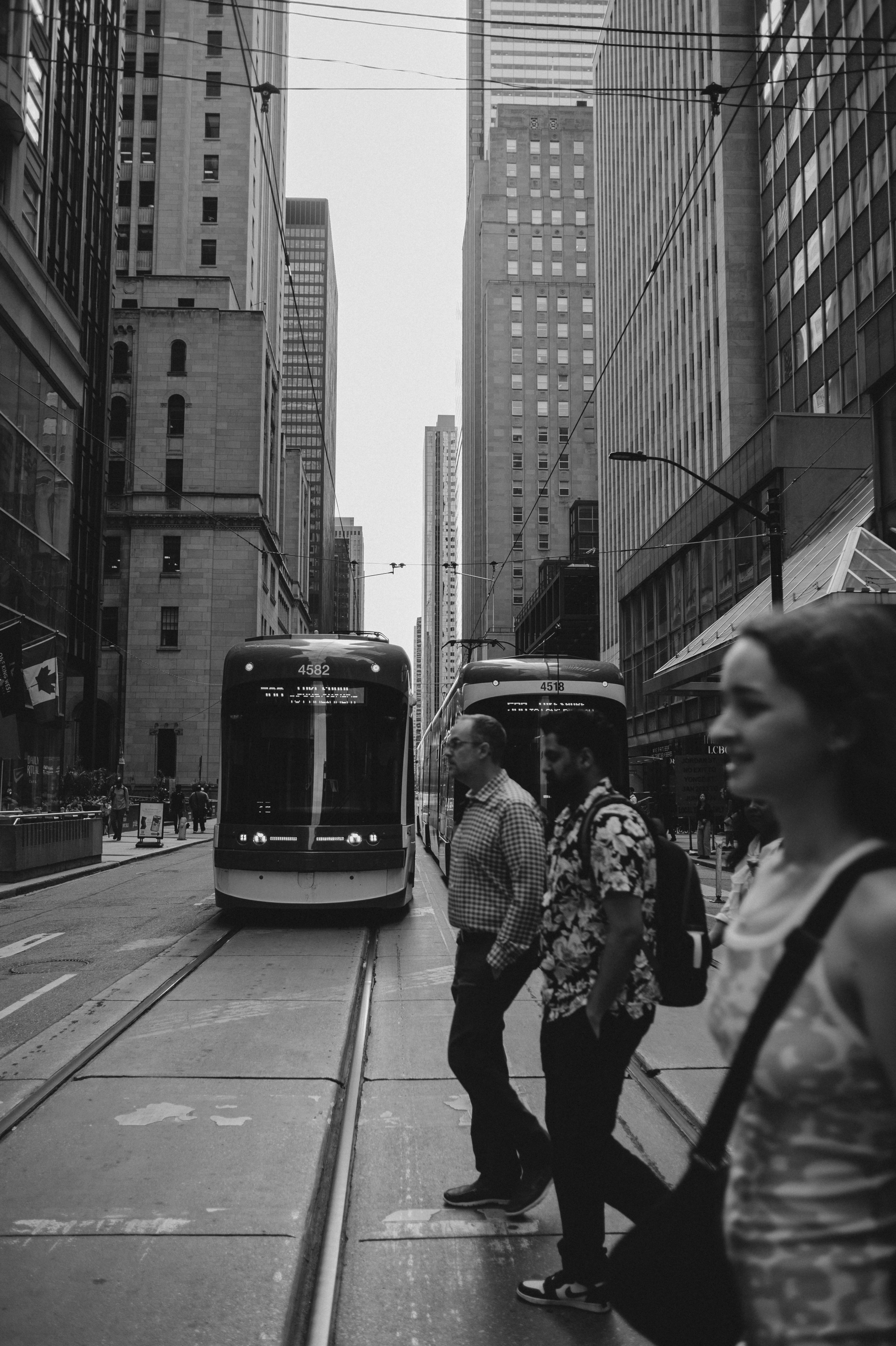 Midtown Trams and Pedestrian Rhythm: A Monochrome Street Scene