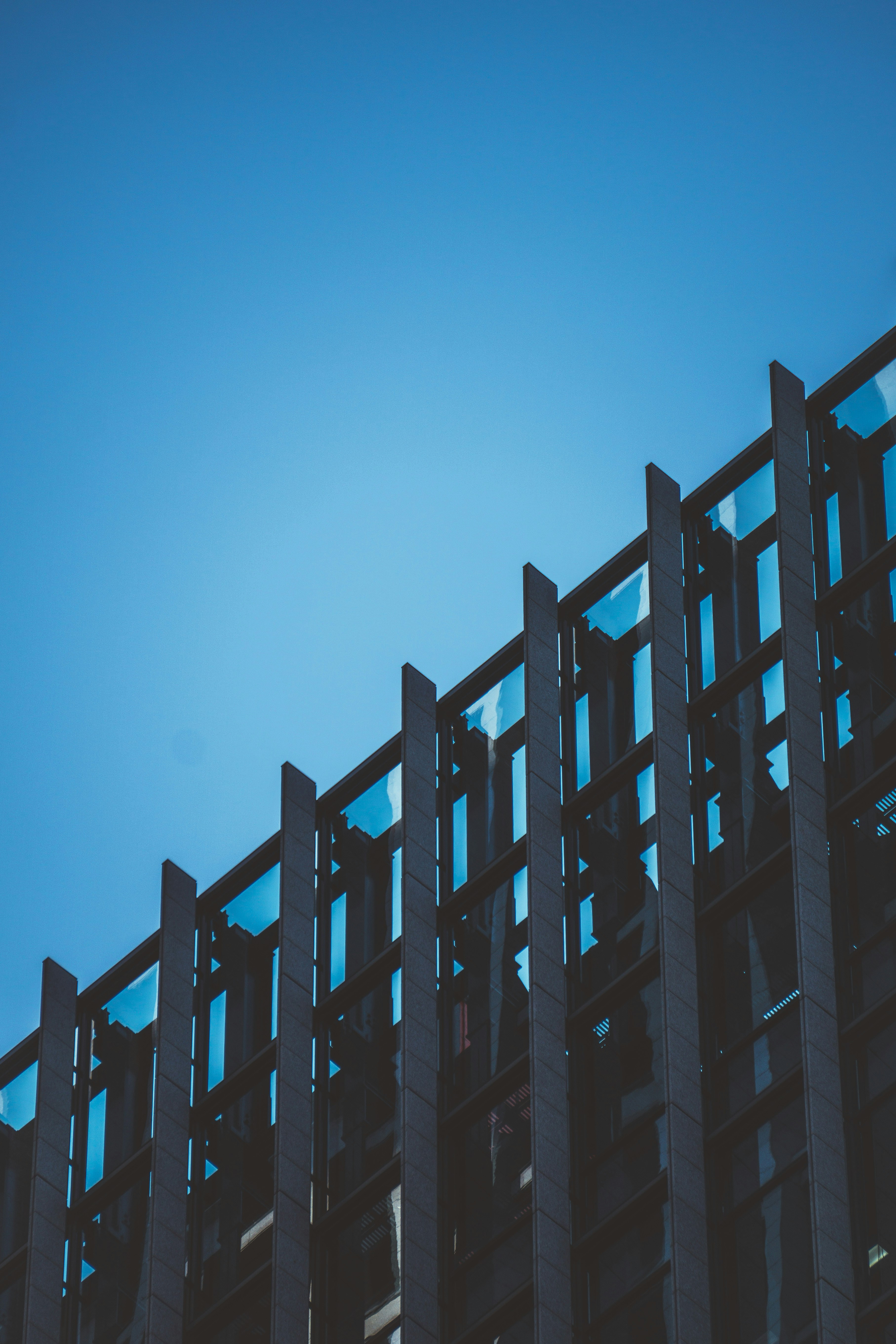 Modern building facade against a clear blue sky