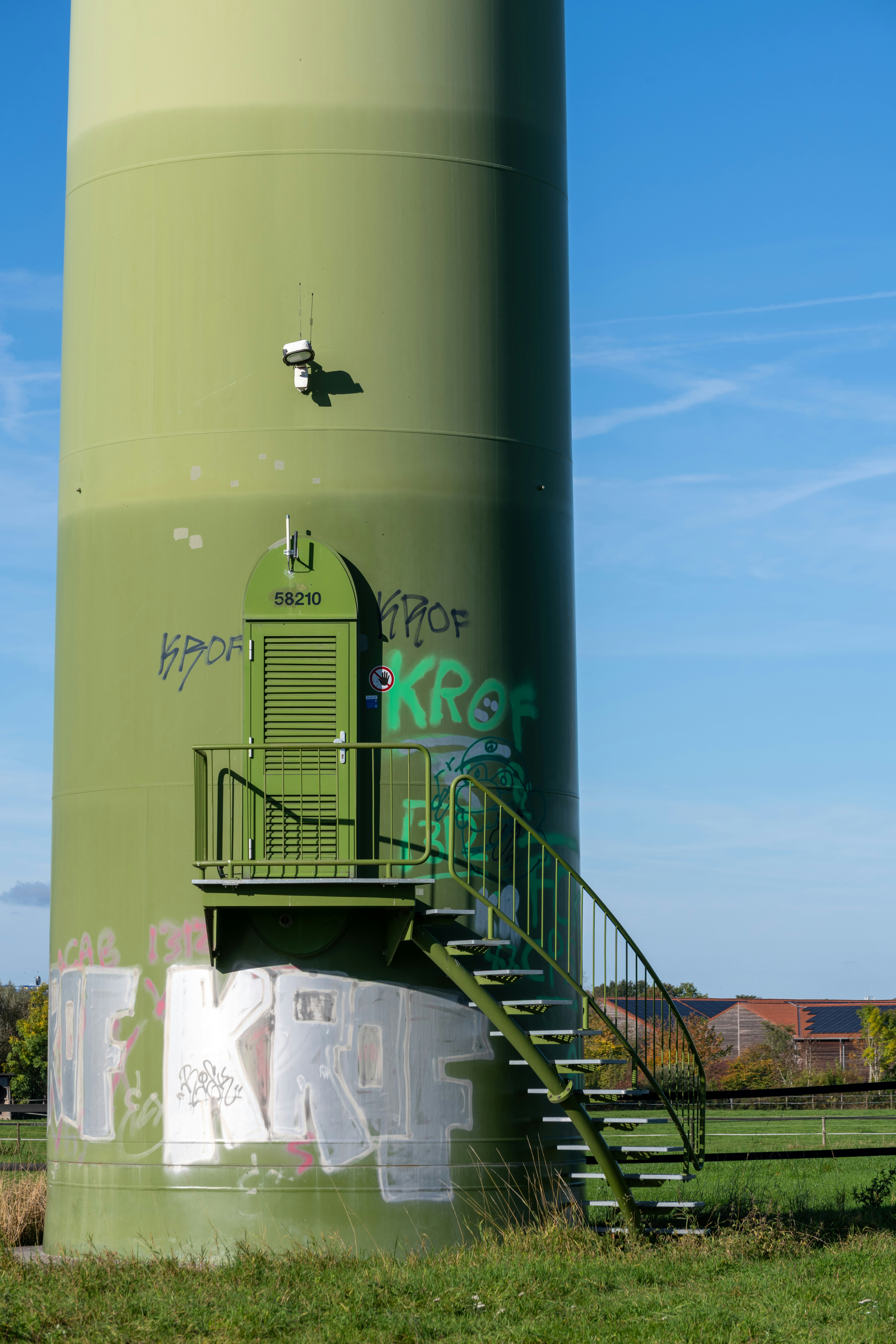 Urban Sentinel: The Graffiti-Emblazoned Water Tower