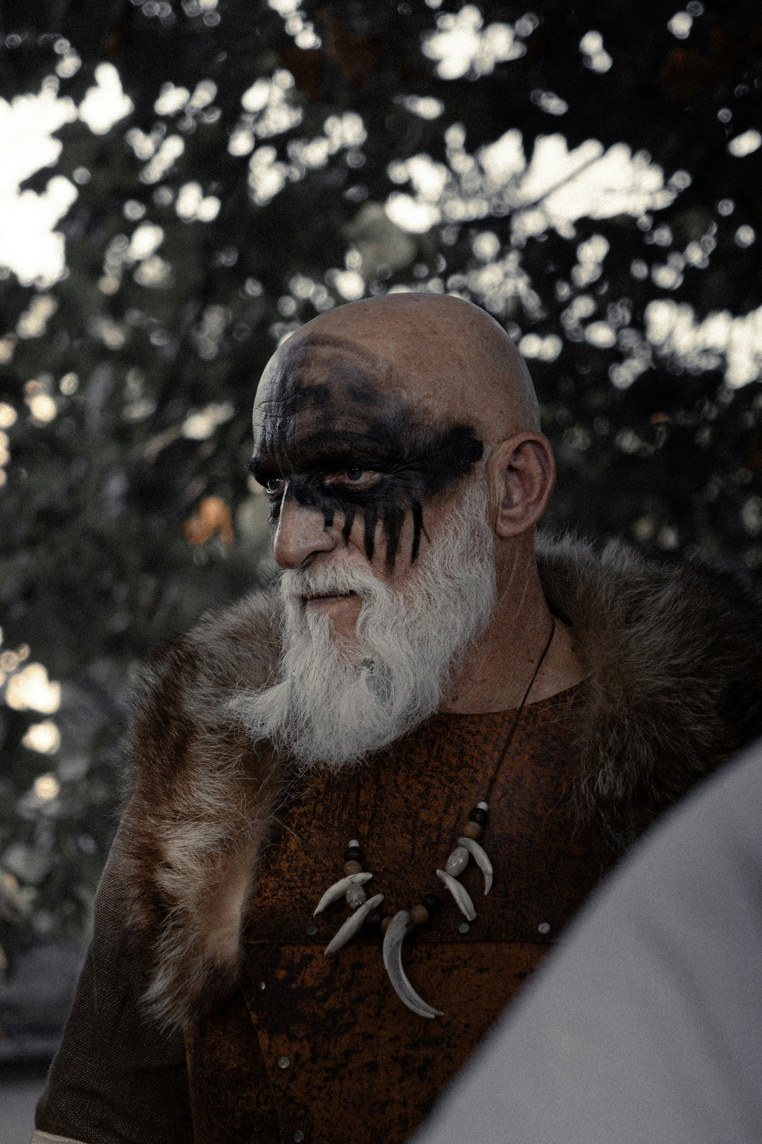Viking-inspired cosplay at Lucca Comics 2024 | Bald man with white beard and face paint