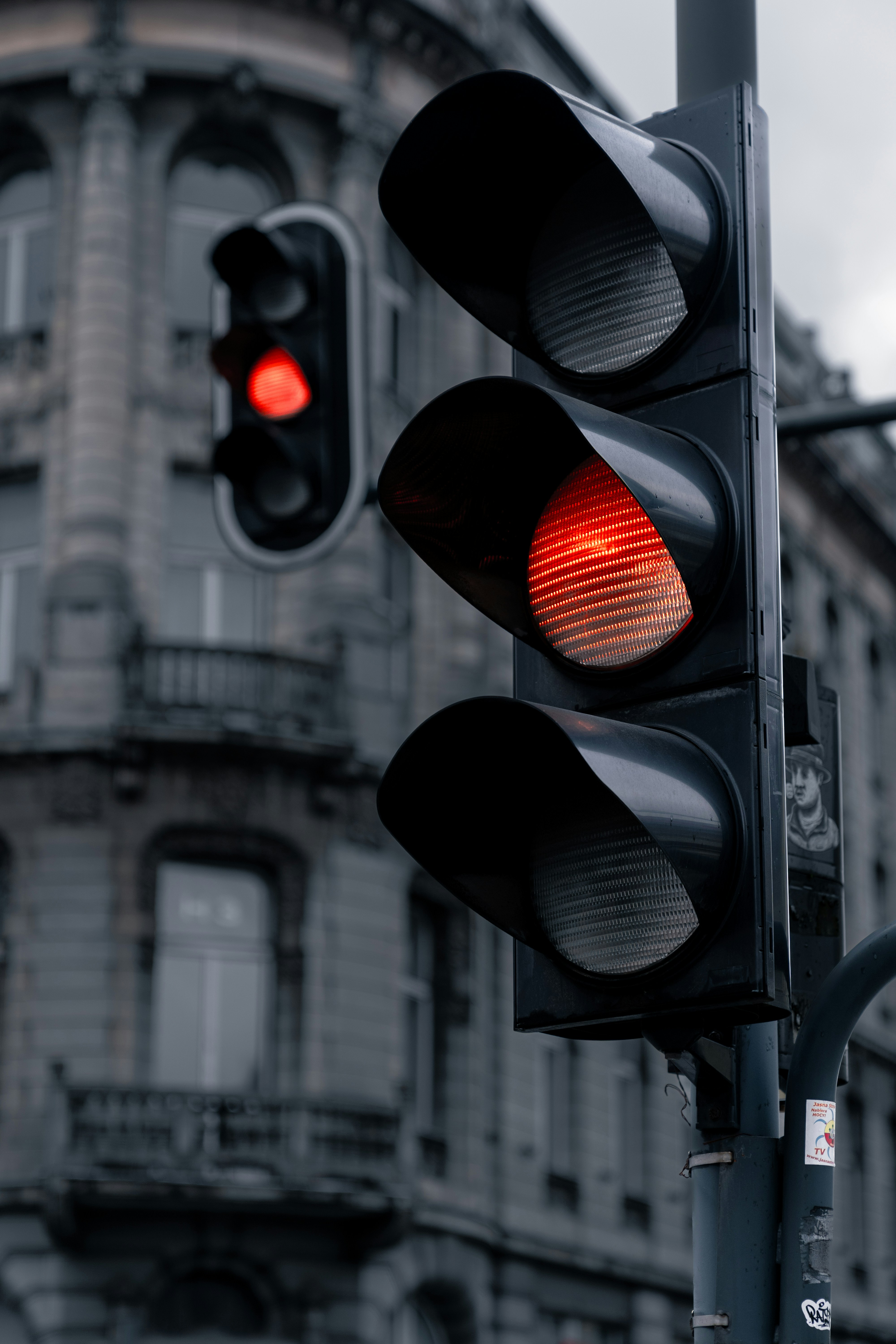 Traffic light showing red signal in city