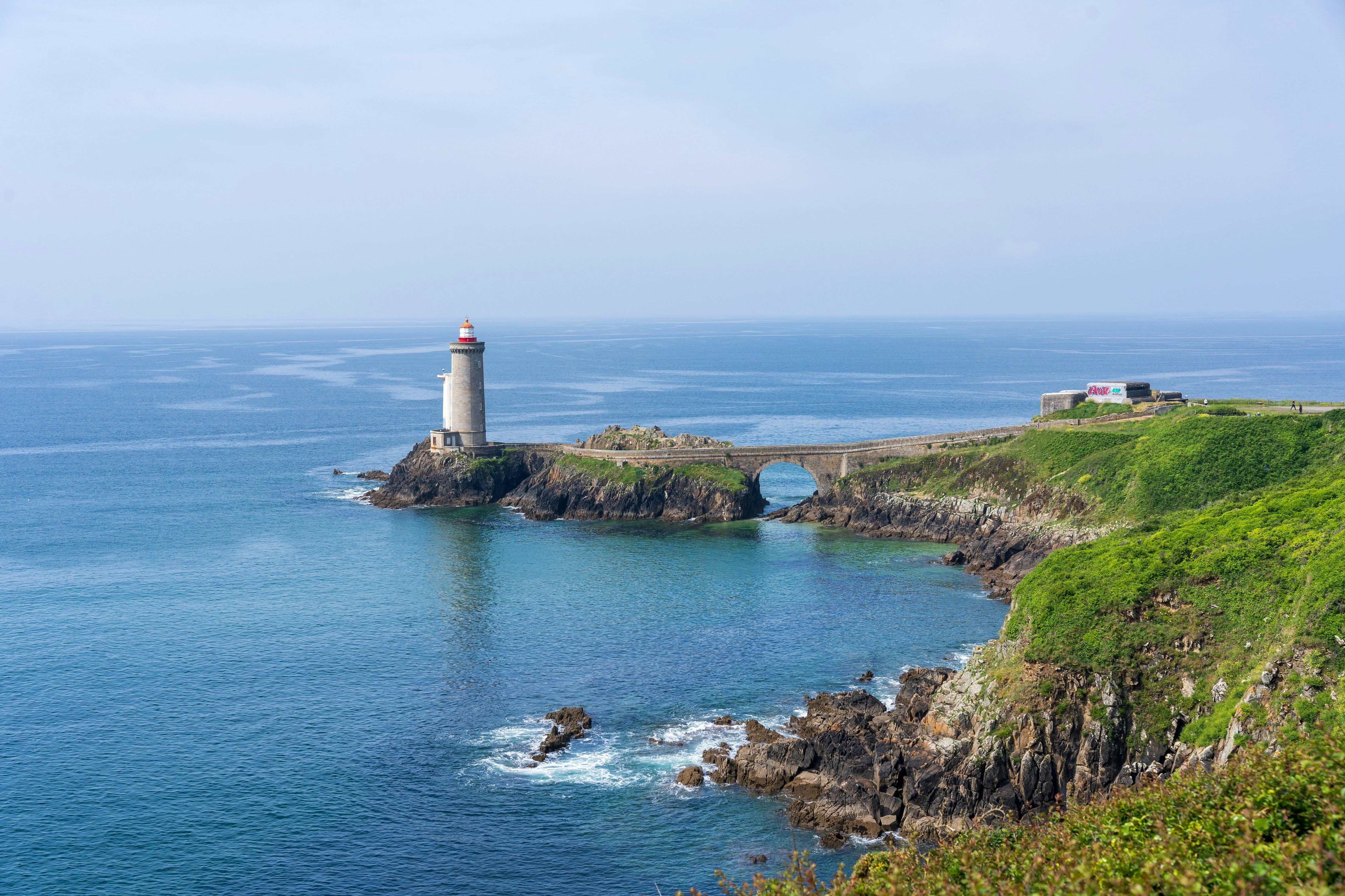 Lighthouse on a rocky coast overlooking the ocean