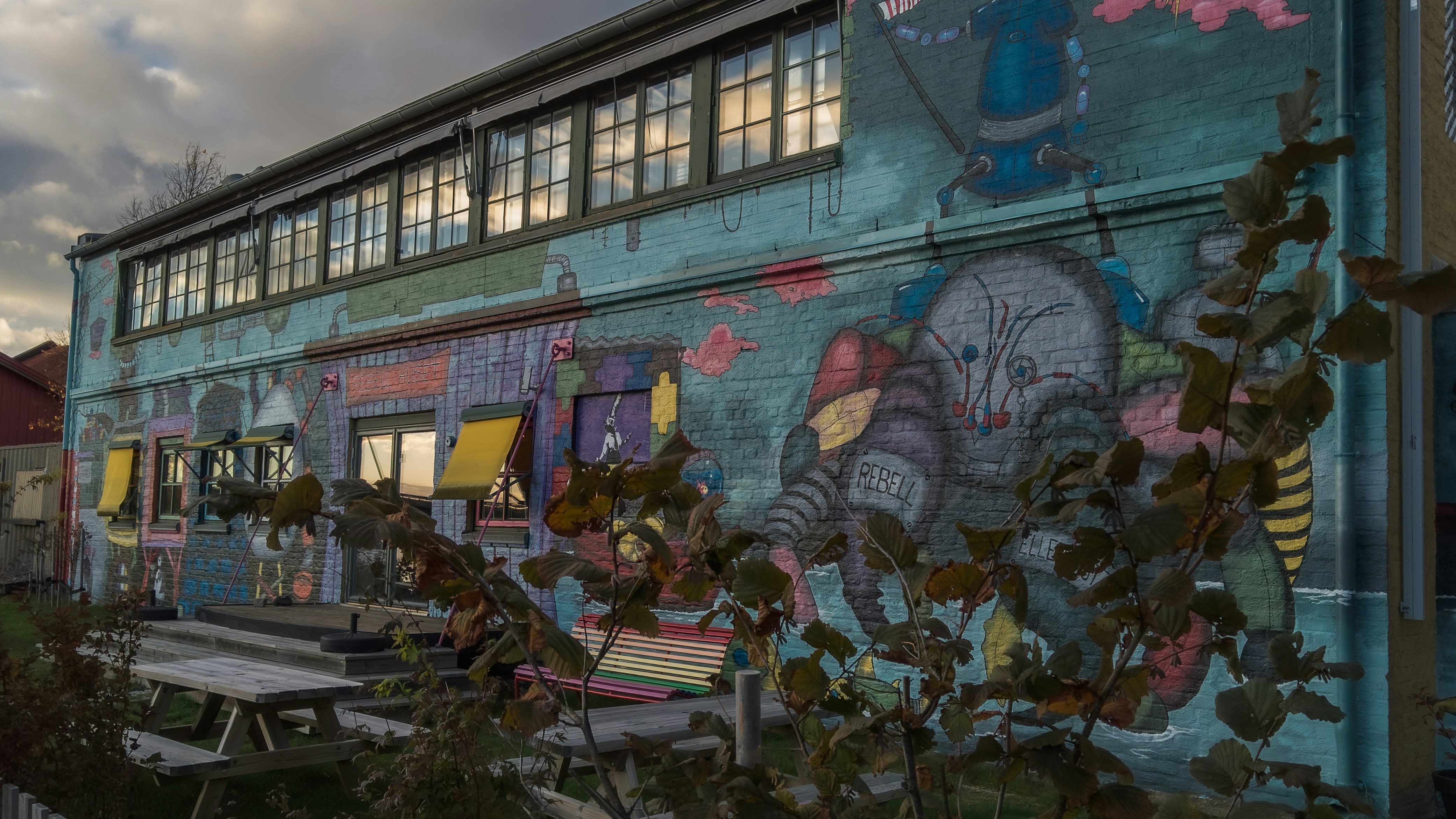 Building with colorful graffiti art and windows