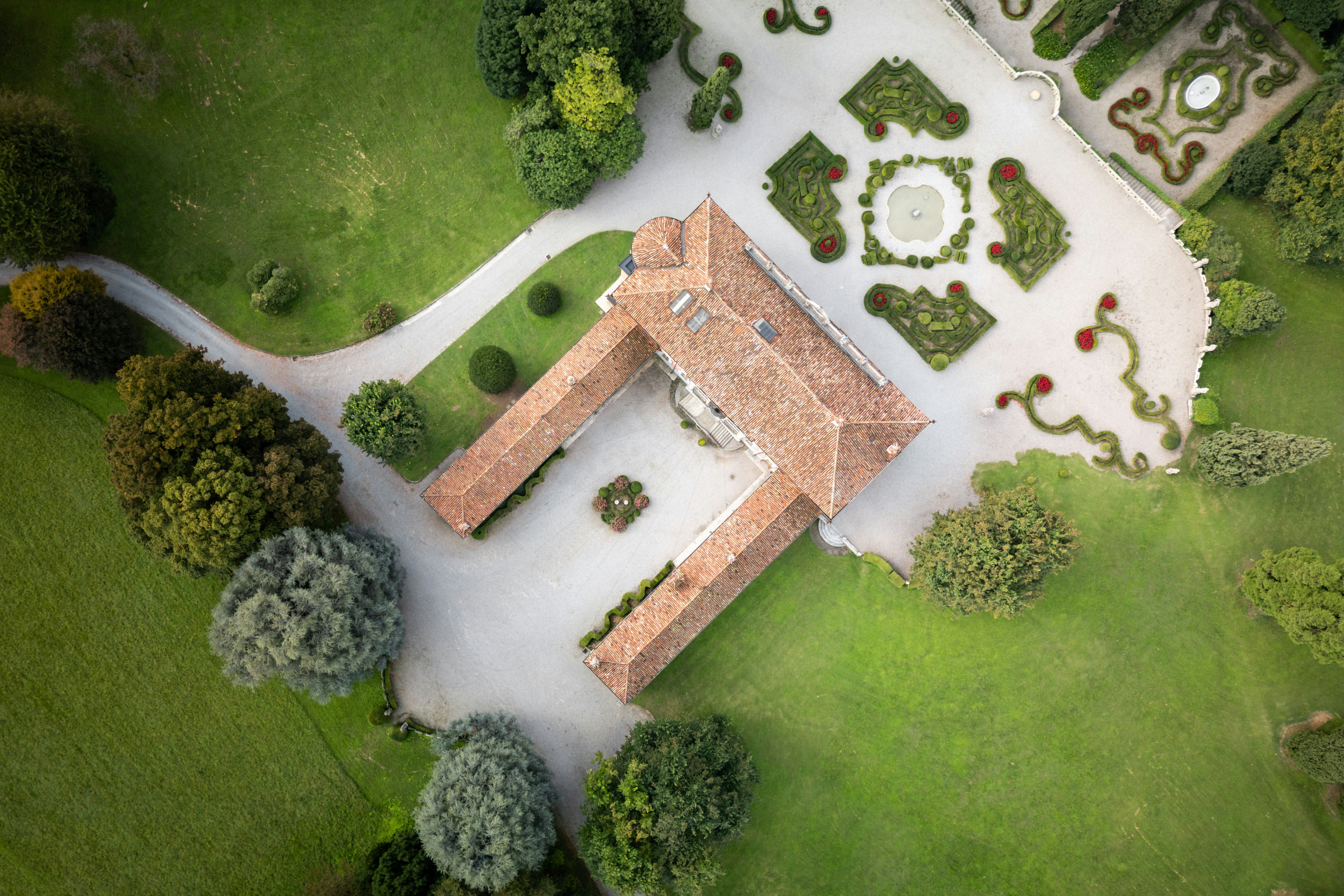Villa Subaglio | Aerial view of a u-shaped building with gardens