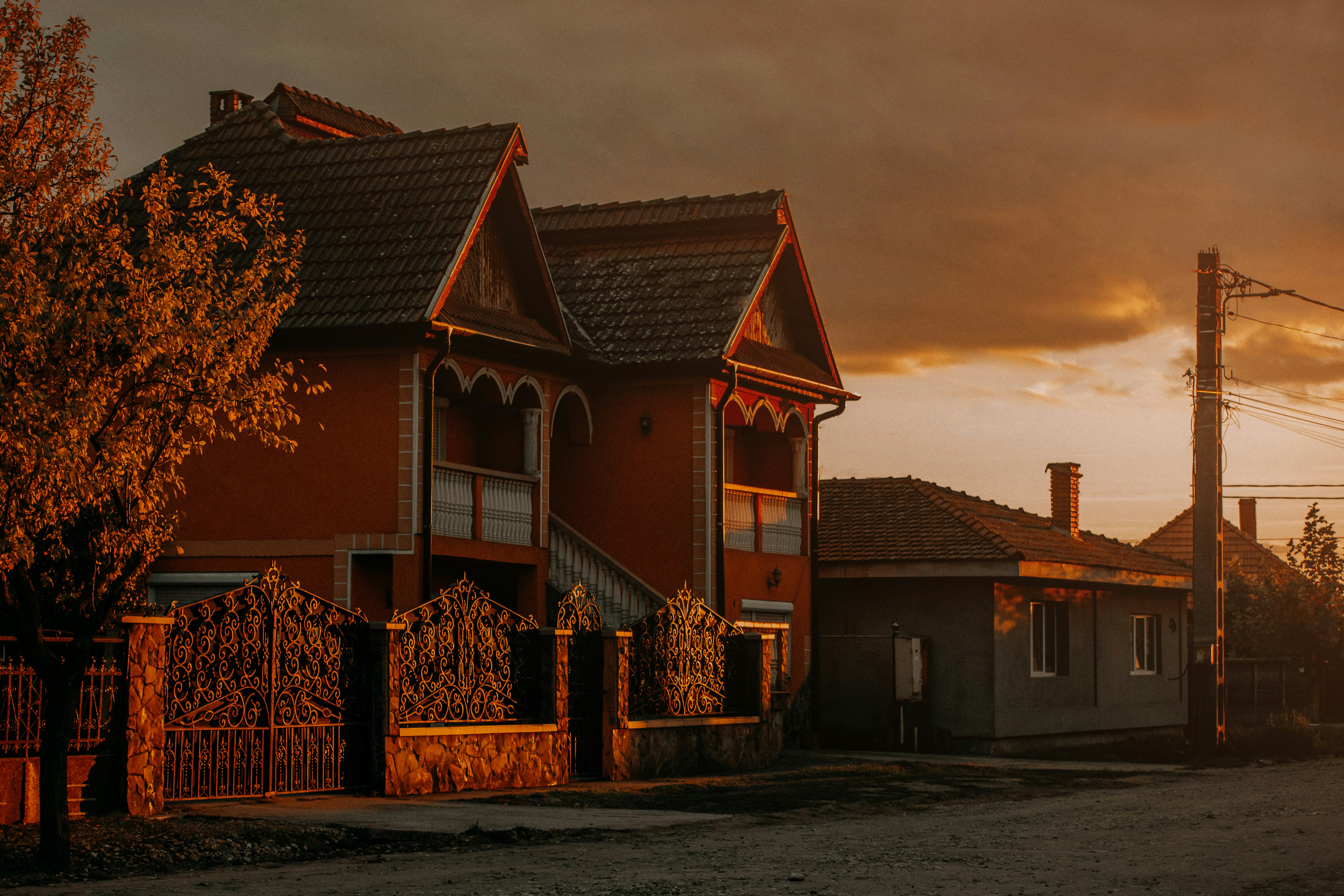 Houses on a street at sunset