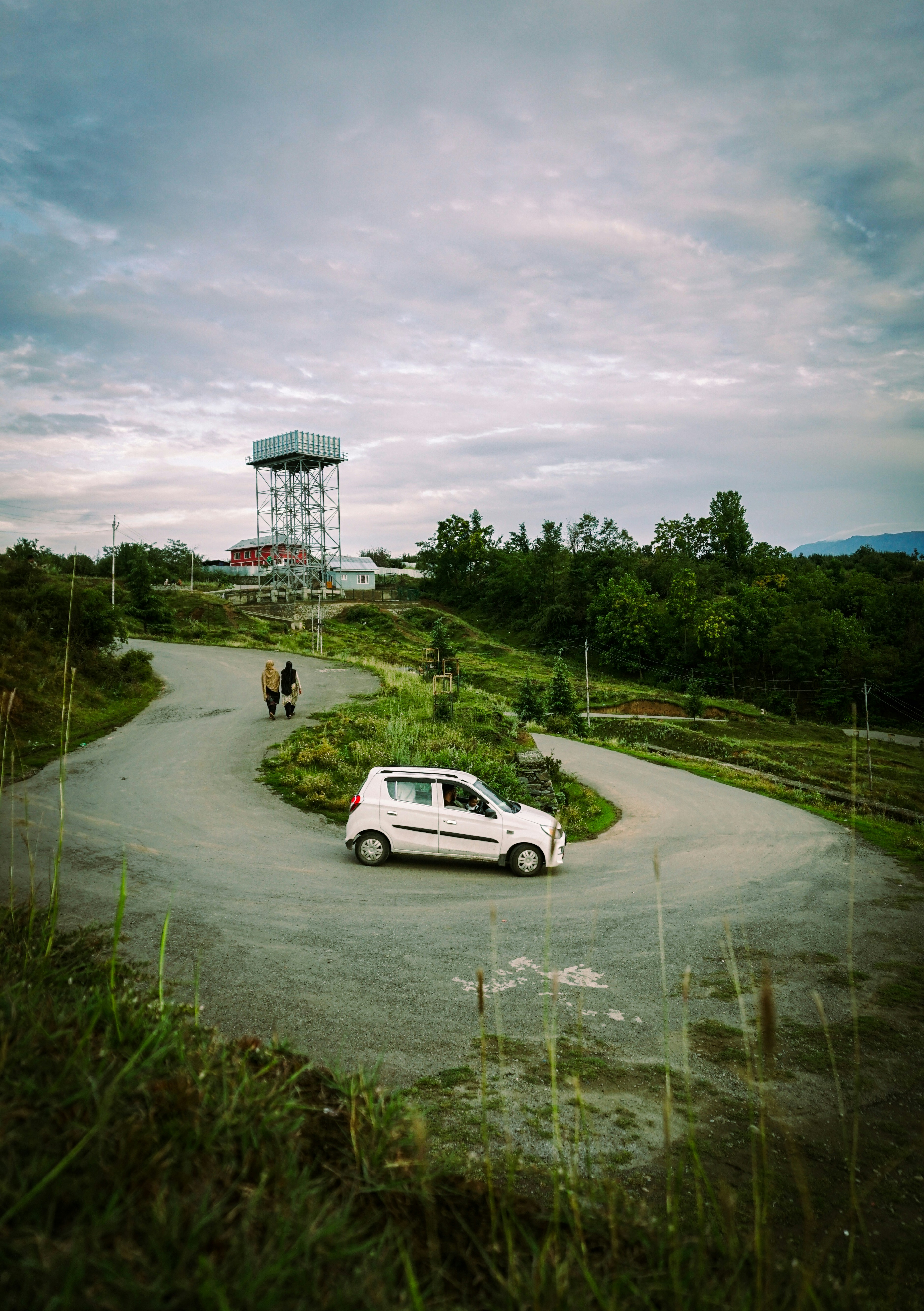 Hillside Hairpin and the White Hatchback by the Water Tower