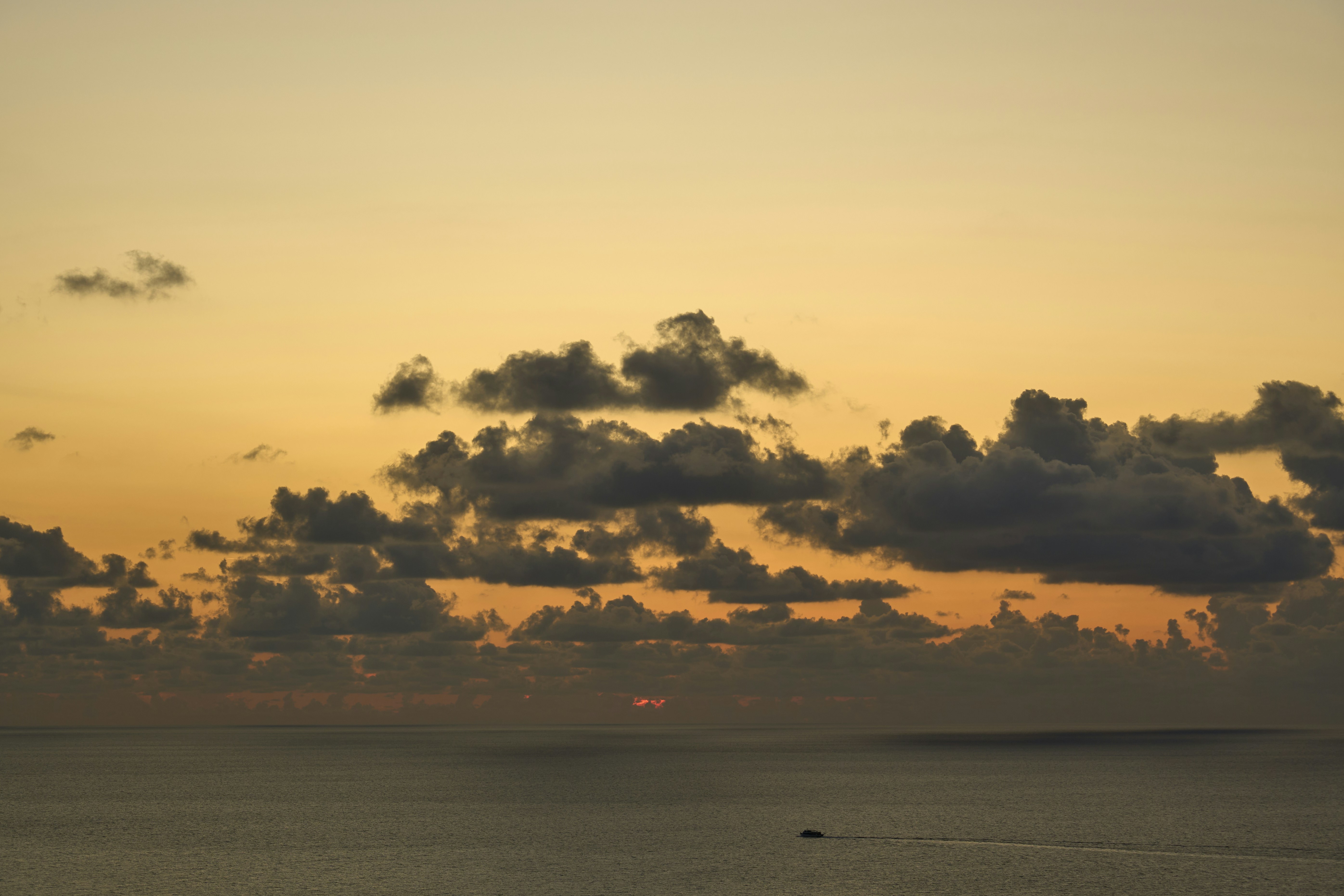 Dramatic clouds over the ocean at sunset