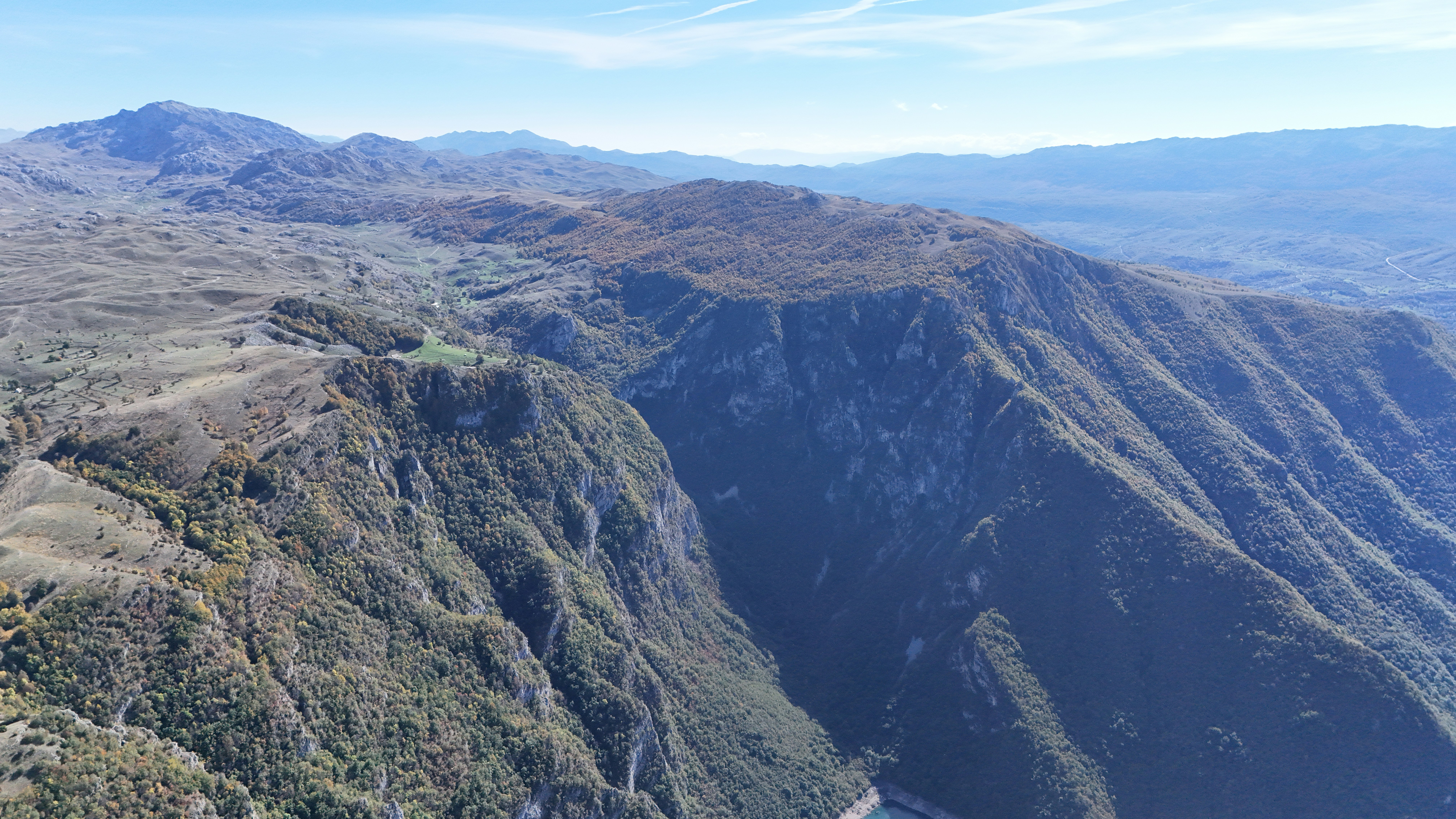 Vast mountainous landscape under a clear sky