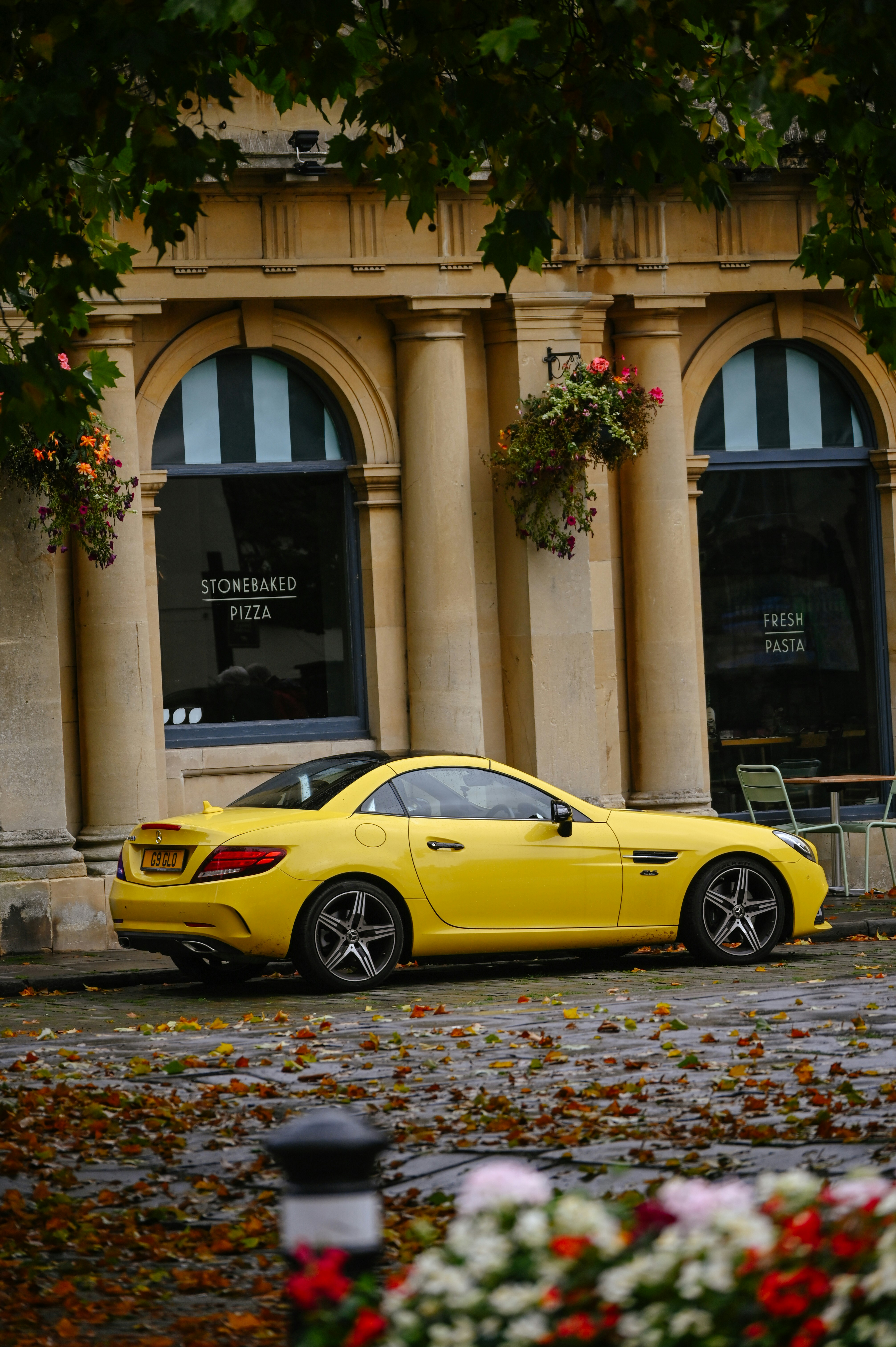Vibrant Elegance: A Yellow Sports Car Amidst Culinary Delights