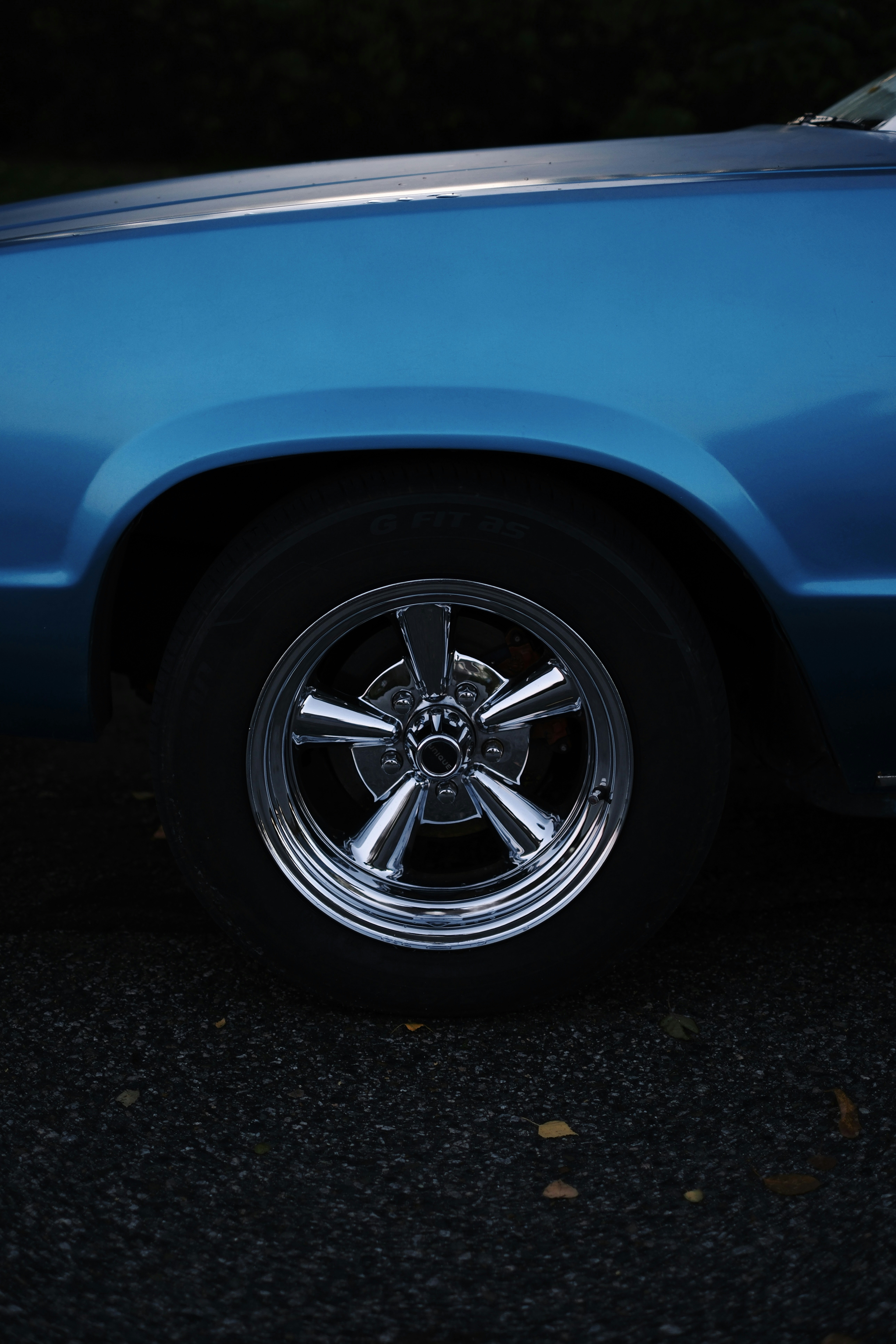 Chrome Elegance: A Classic Wheel's Reflection