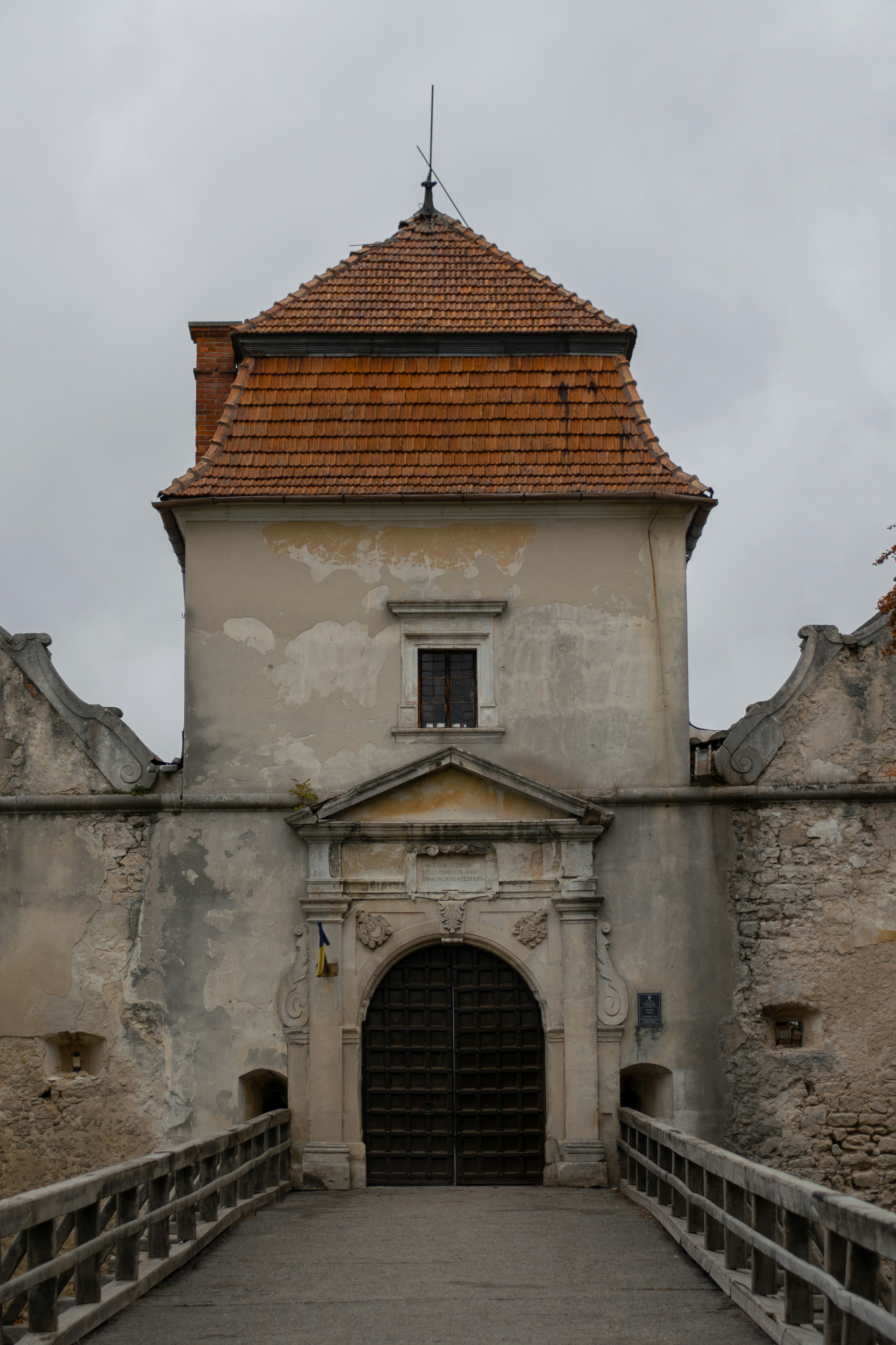 Ancient stone castle gate with wooden bridge