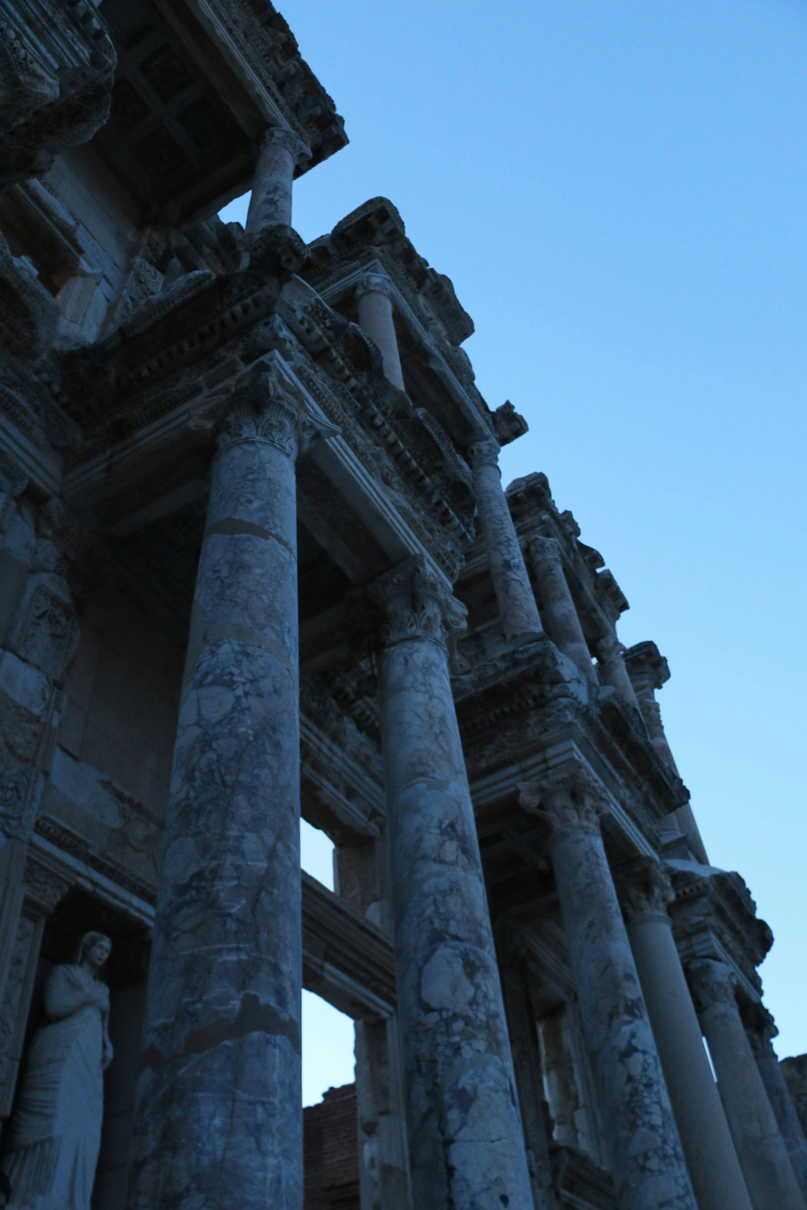 Ancient stone ruins with tall columns against blue sky