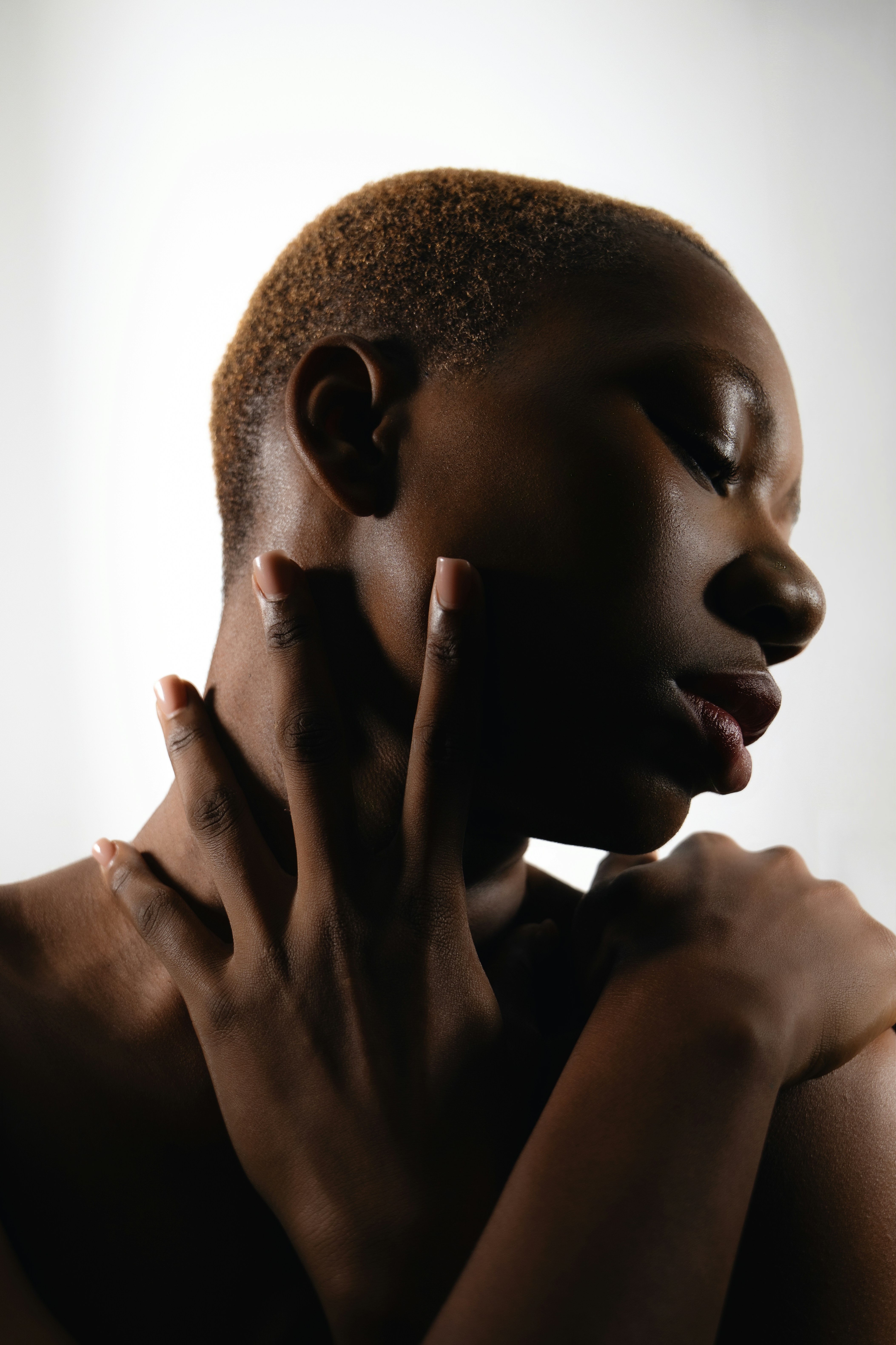 Luminous Quiet: A Side-Profile Portrait Bathed in Velvet Light
