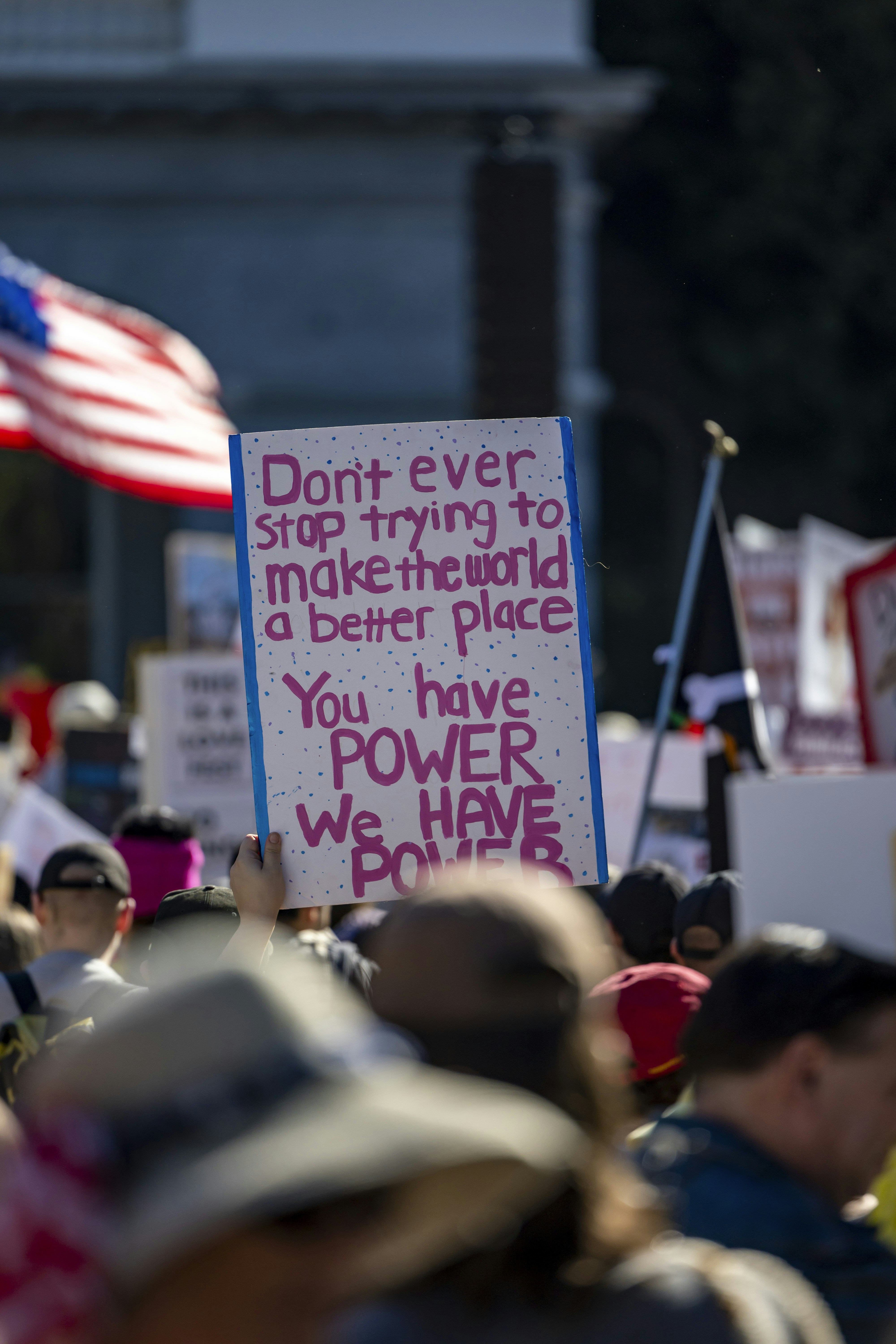 Protest sign reads "you have power we have power"