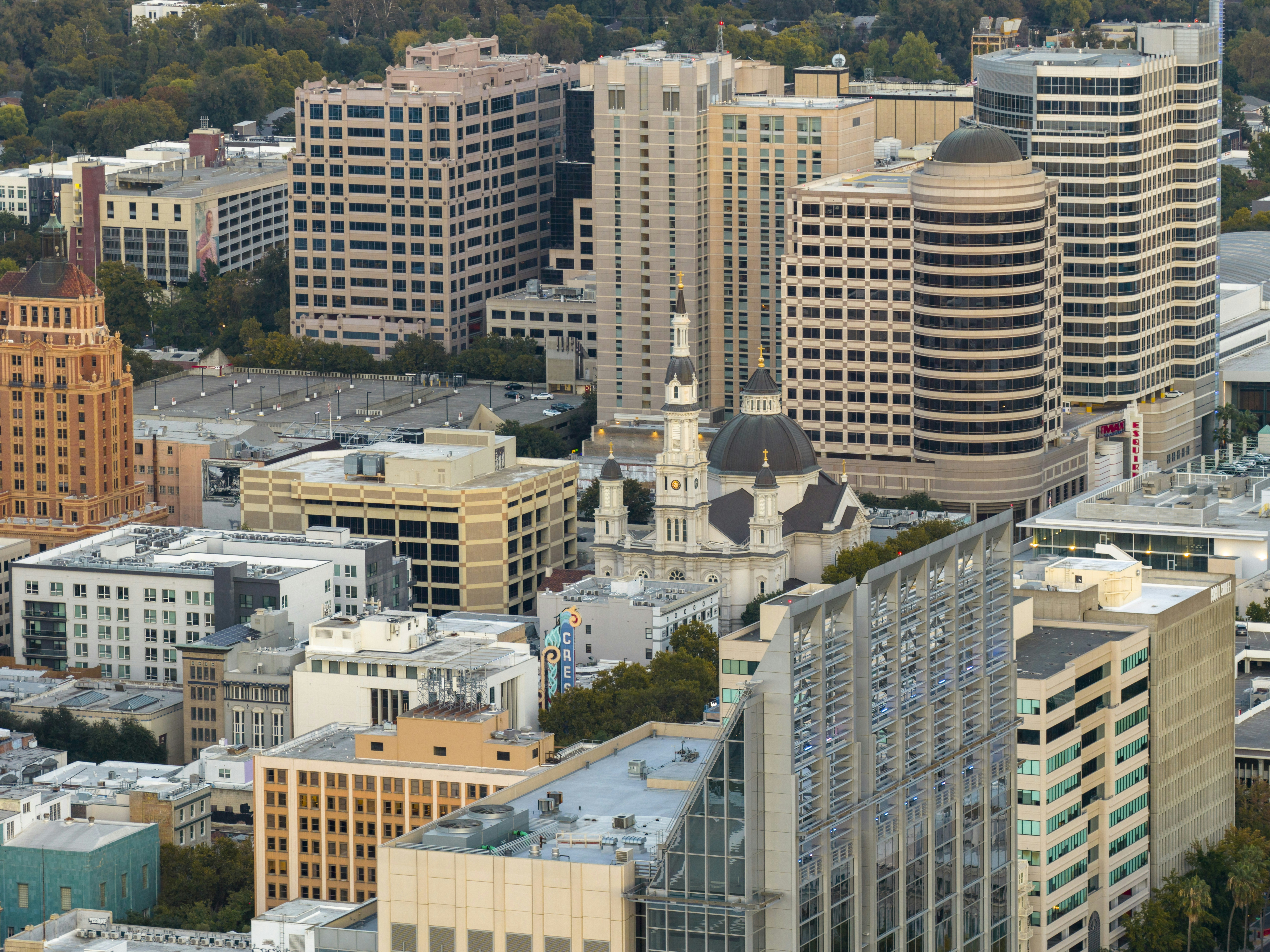 Aerial view of a dense urban cityscape with diverse buildings.