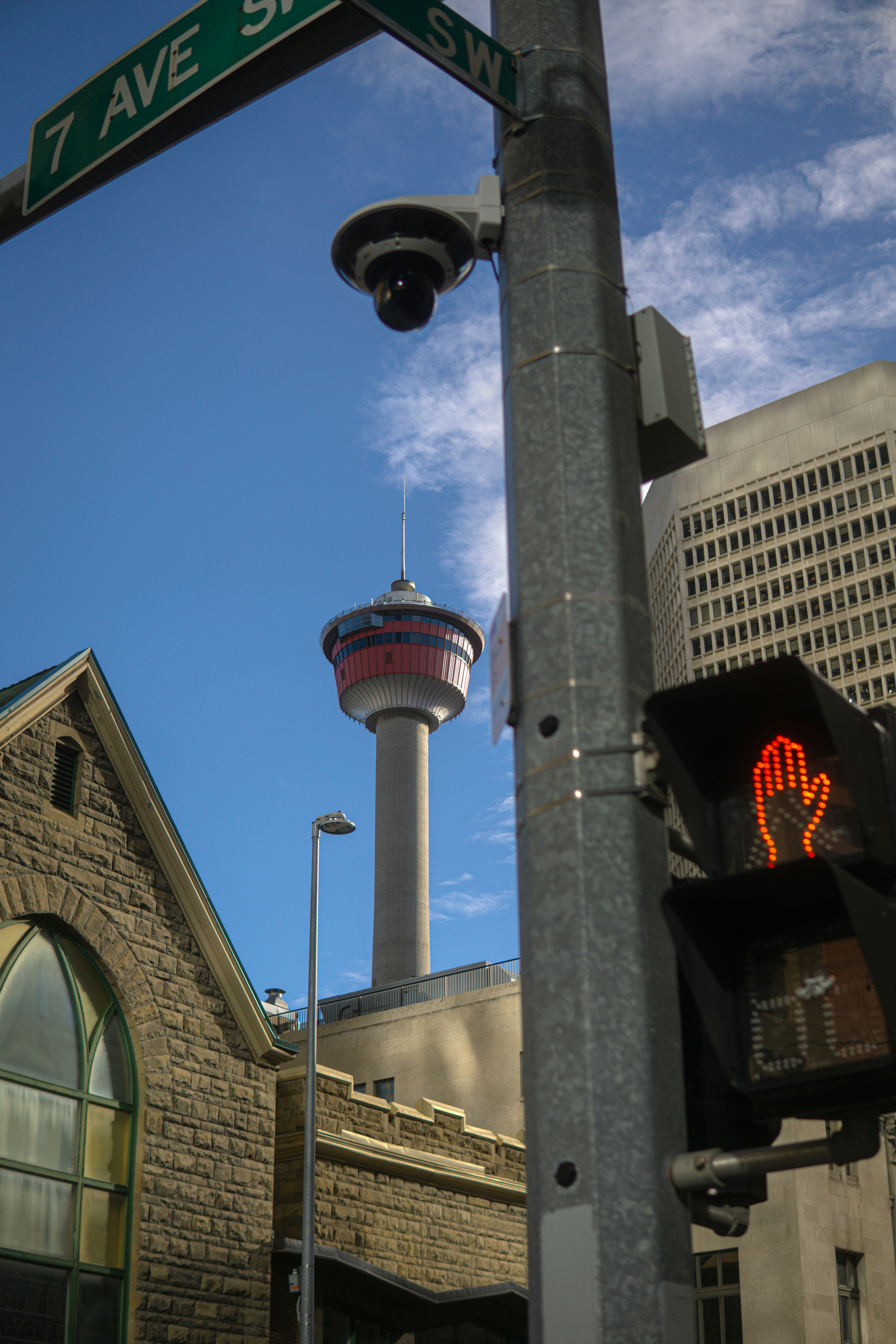 Vertical Icon Amid Street Corners: CN Tower Rising Over a Downtown Crosswalk