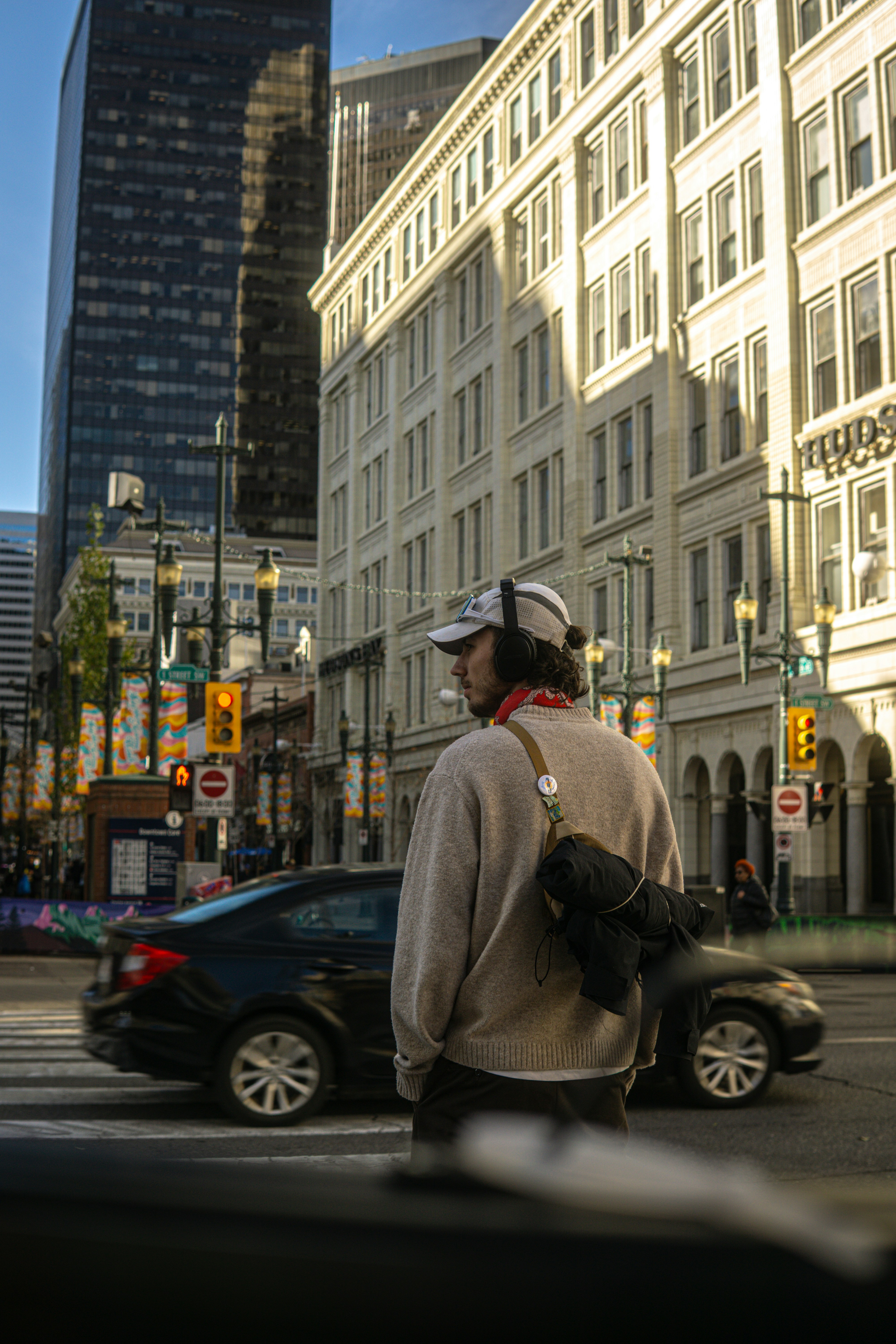 Headphones in the City: A Sunlit Downtown Portrait of a Commuter