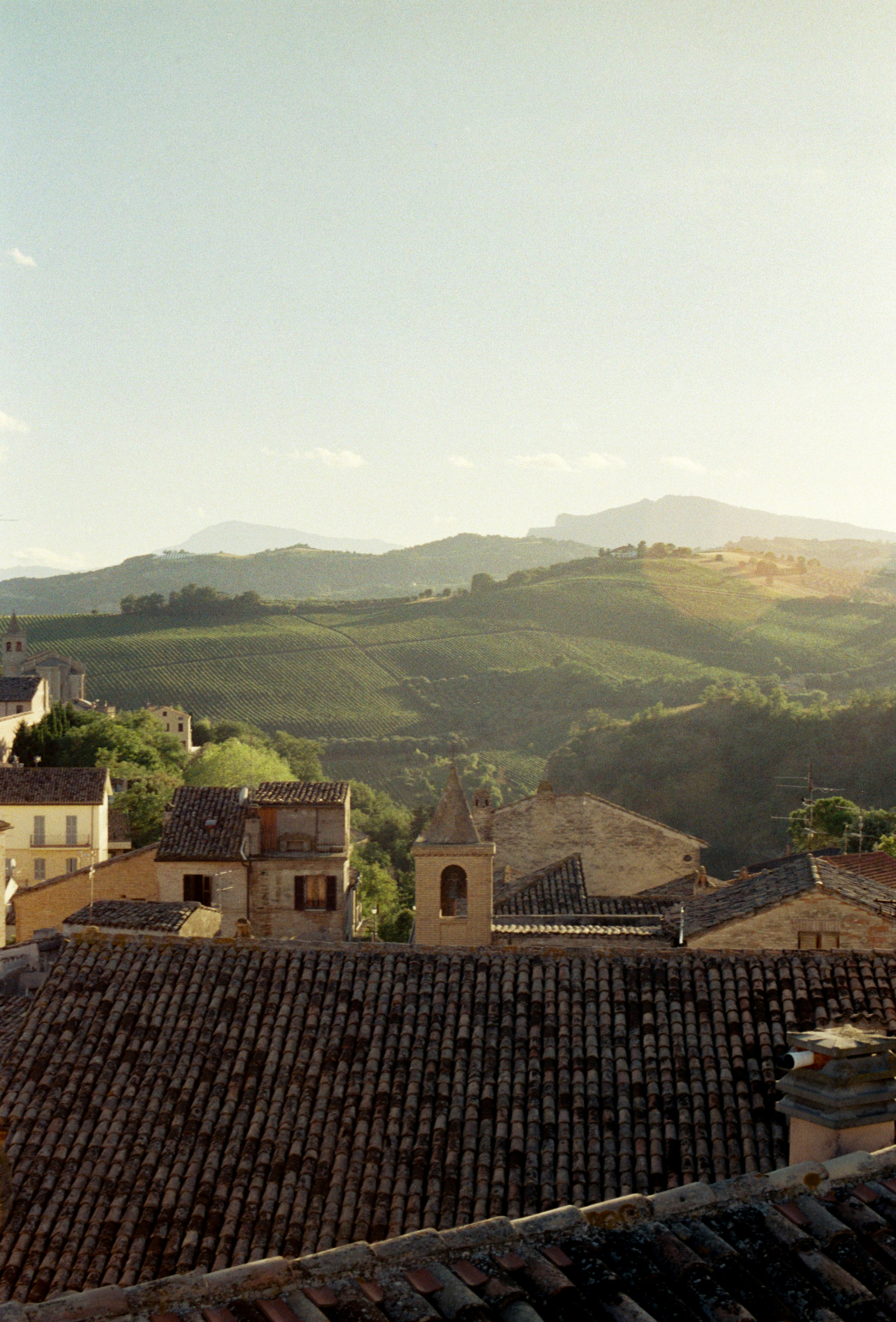 Rooftops and rolling hills in a european village.