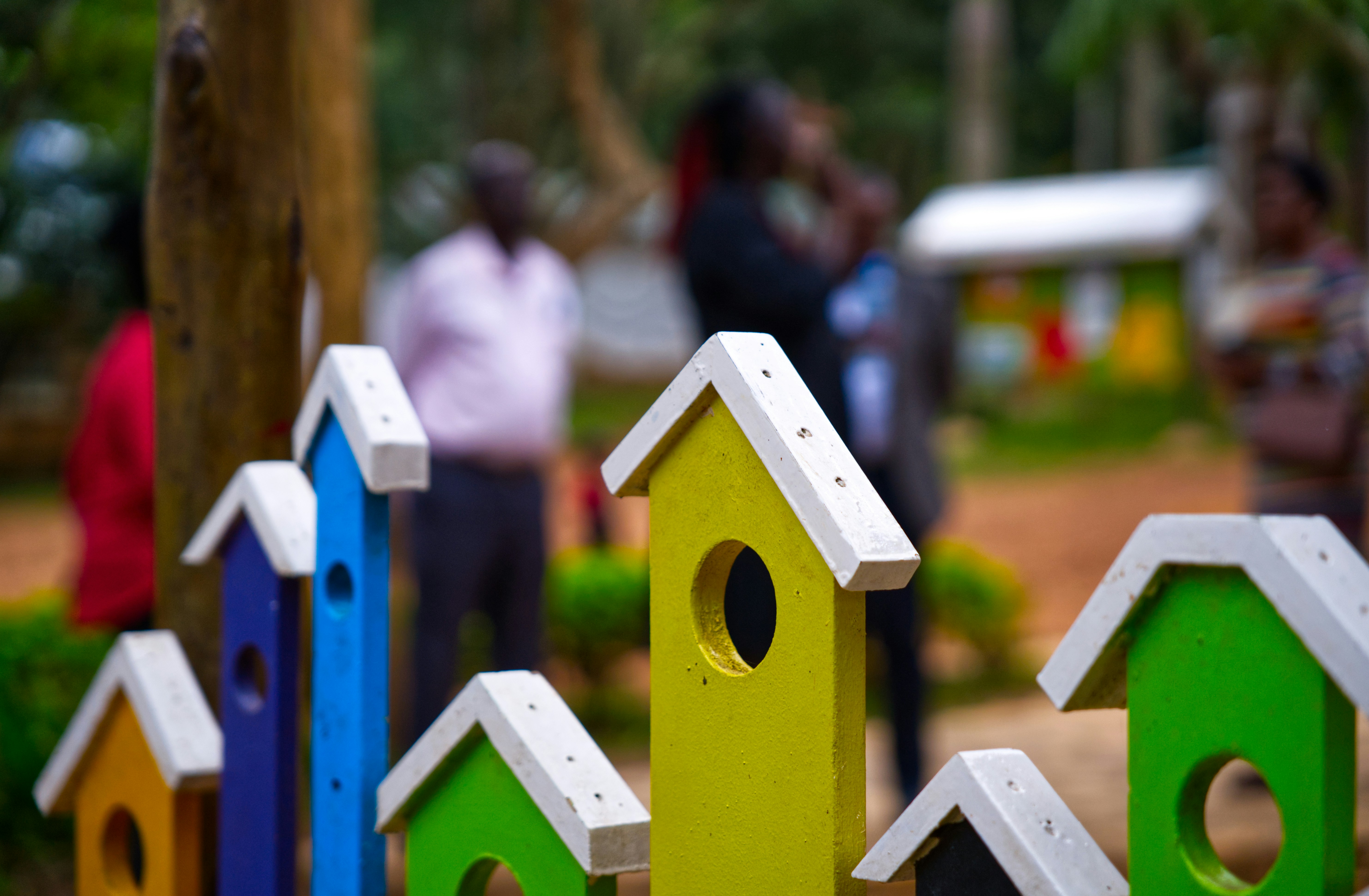 A very colorful Place | Colorful birdhouses lined up in a park