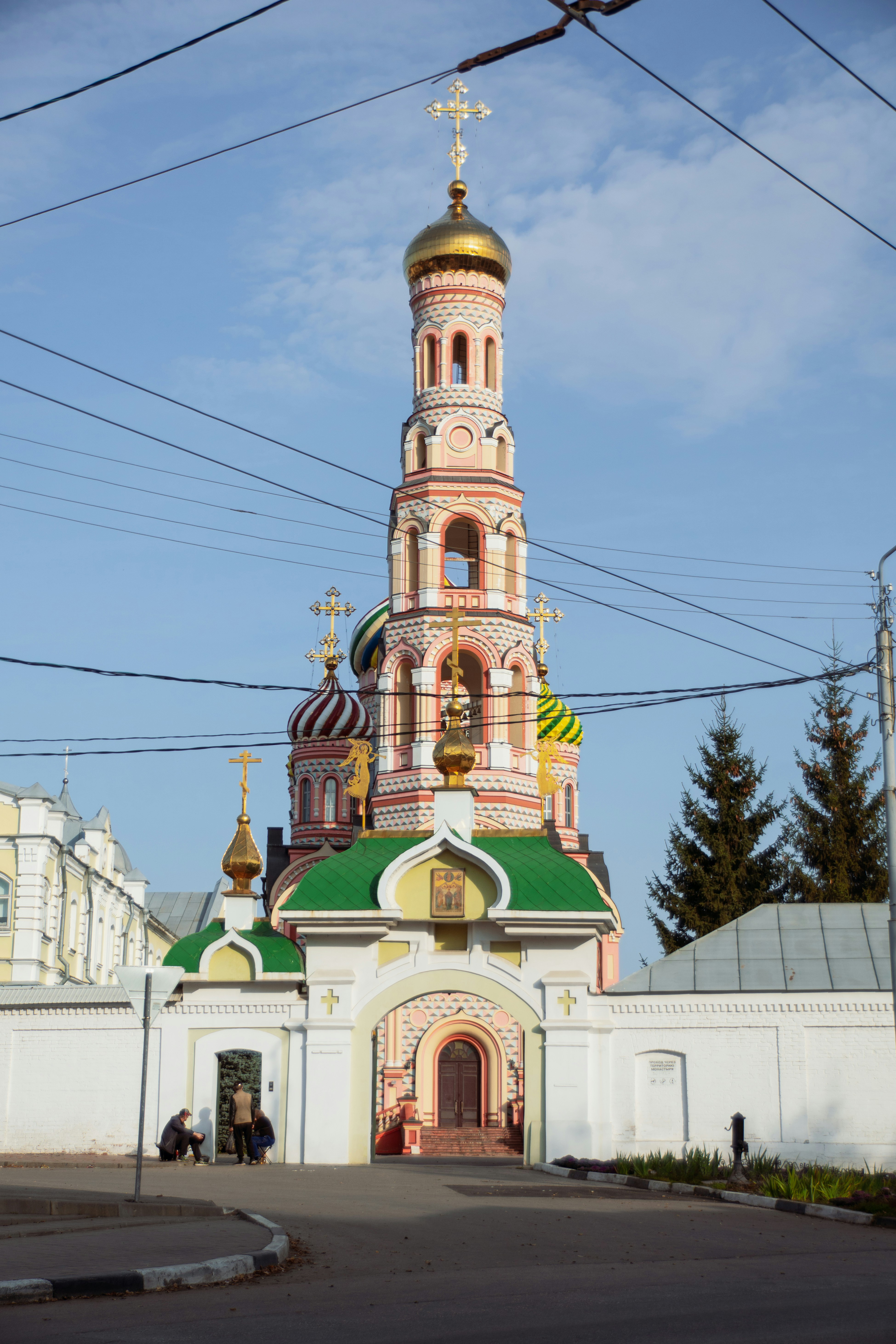 Ornate church with green roofs and golden domes.