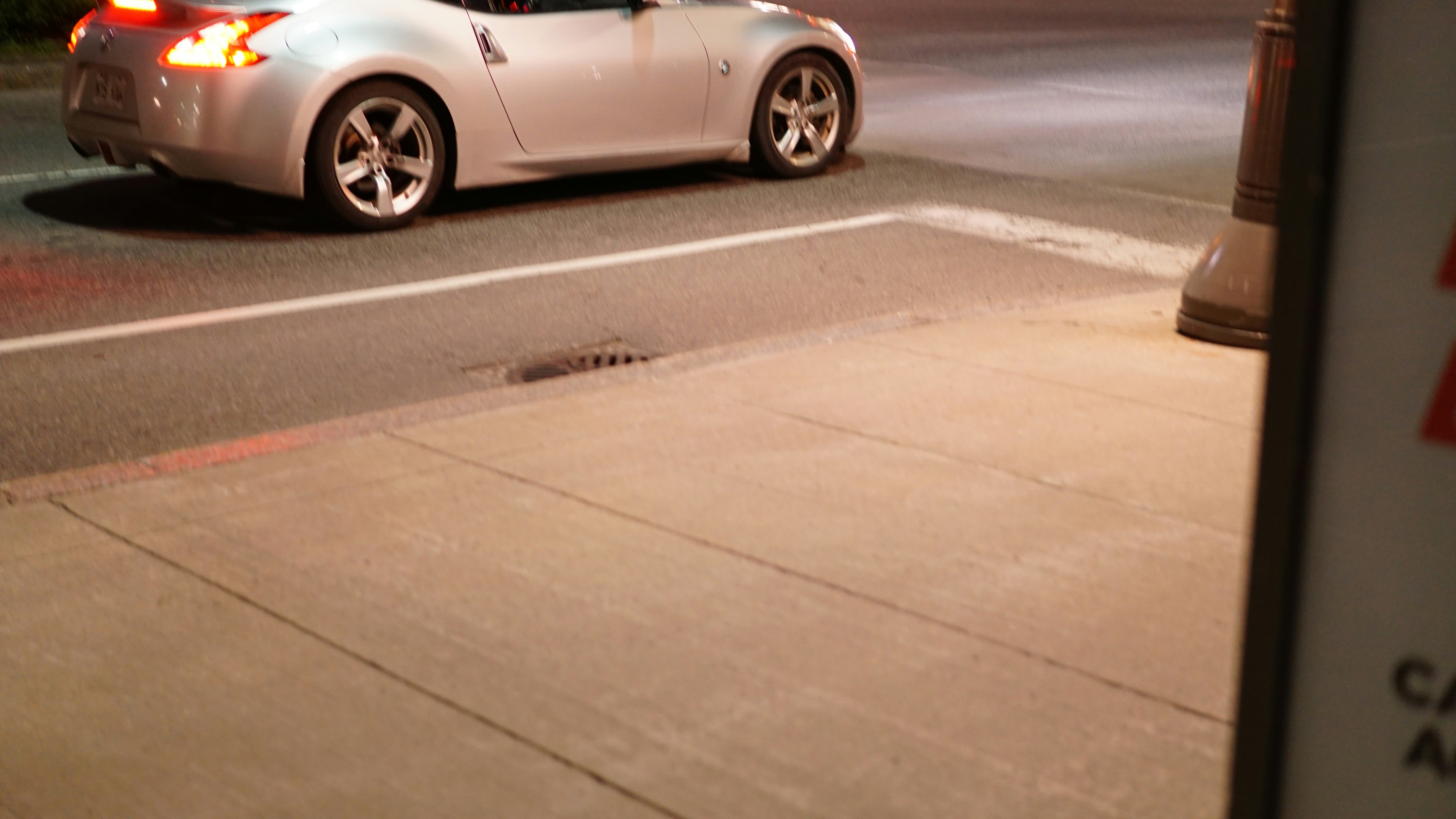 Urban Motion: The Silver Sports Car at Night