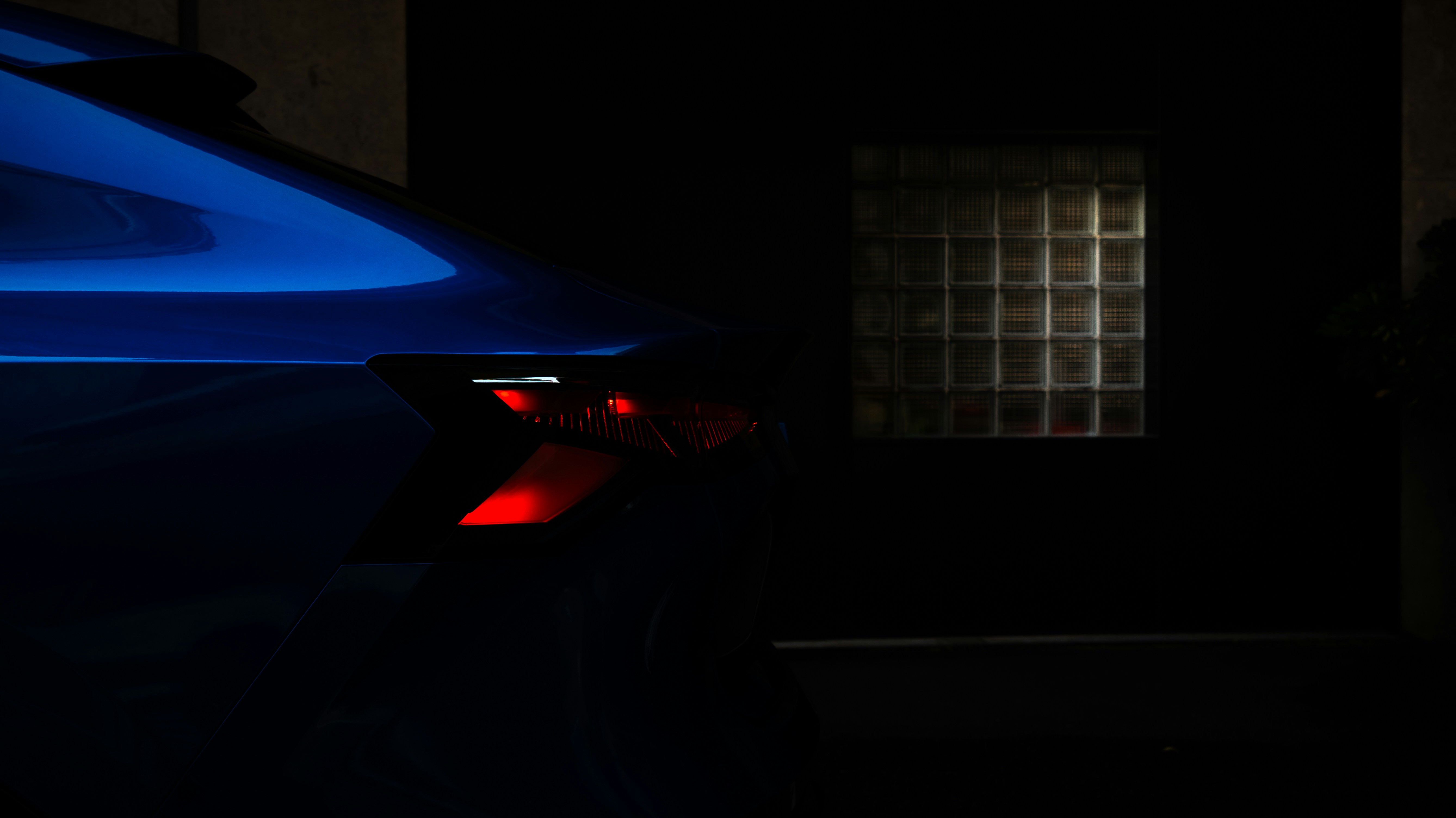 no | Blue car taillight glowing in the dark