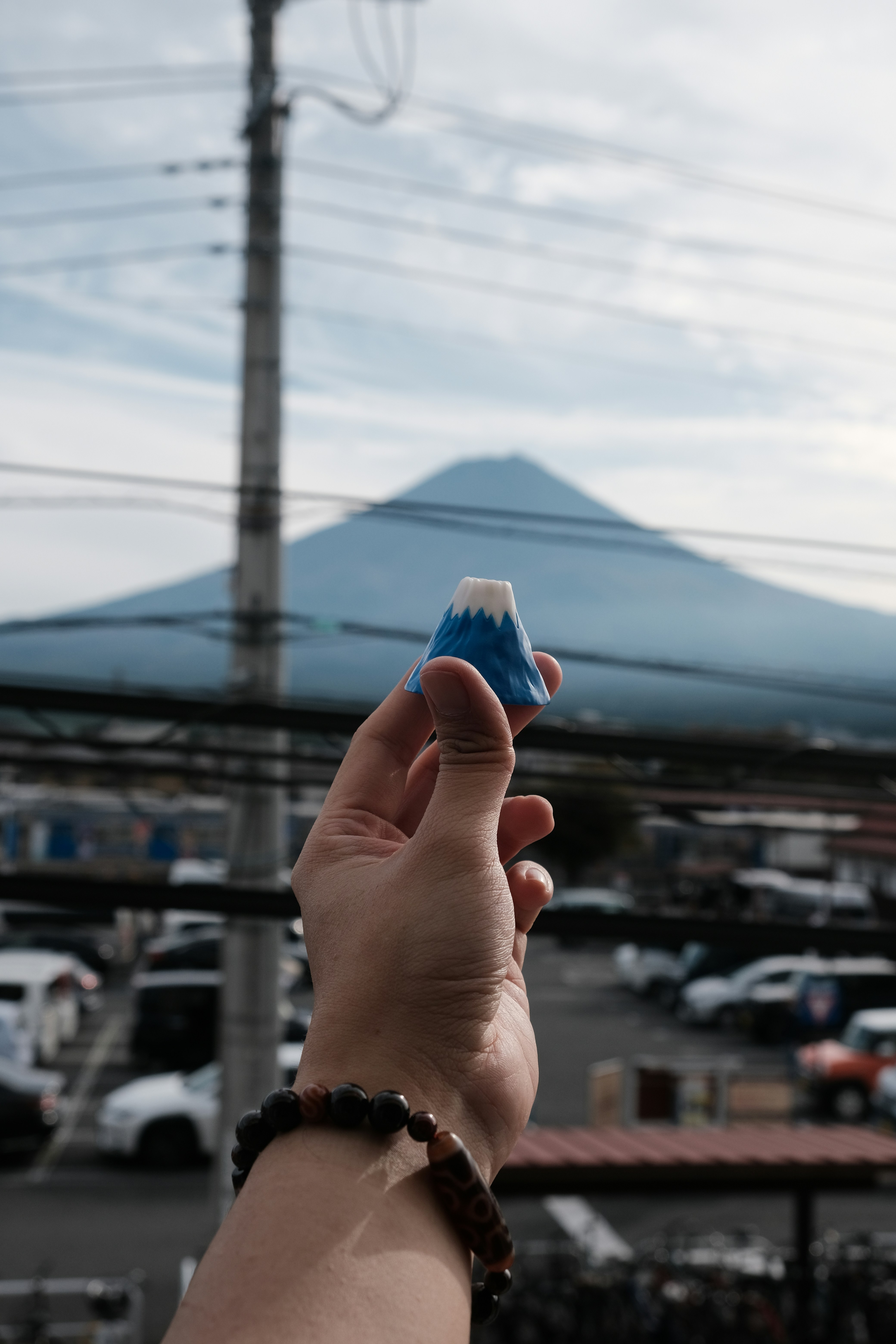 Candy Peak in Hand: A Tiny Summit Framed by Mount Fuji