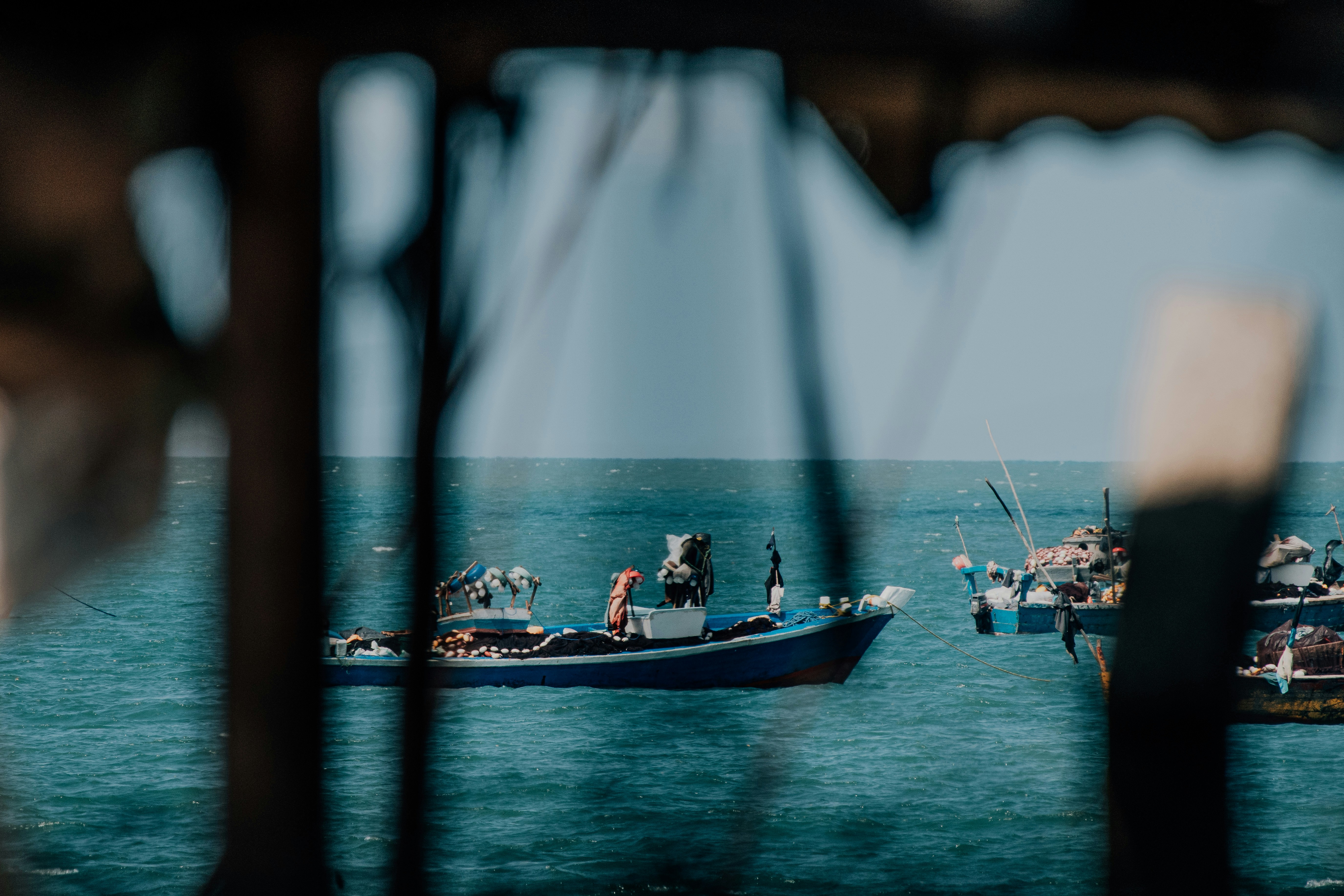 Fishing boats in the ocean | Boats floating on the blue ocean water