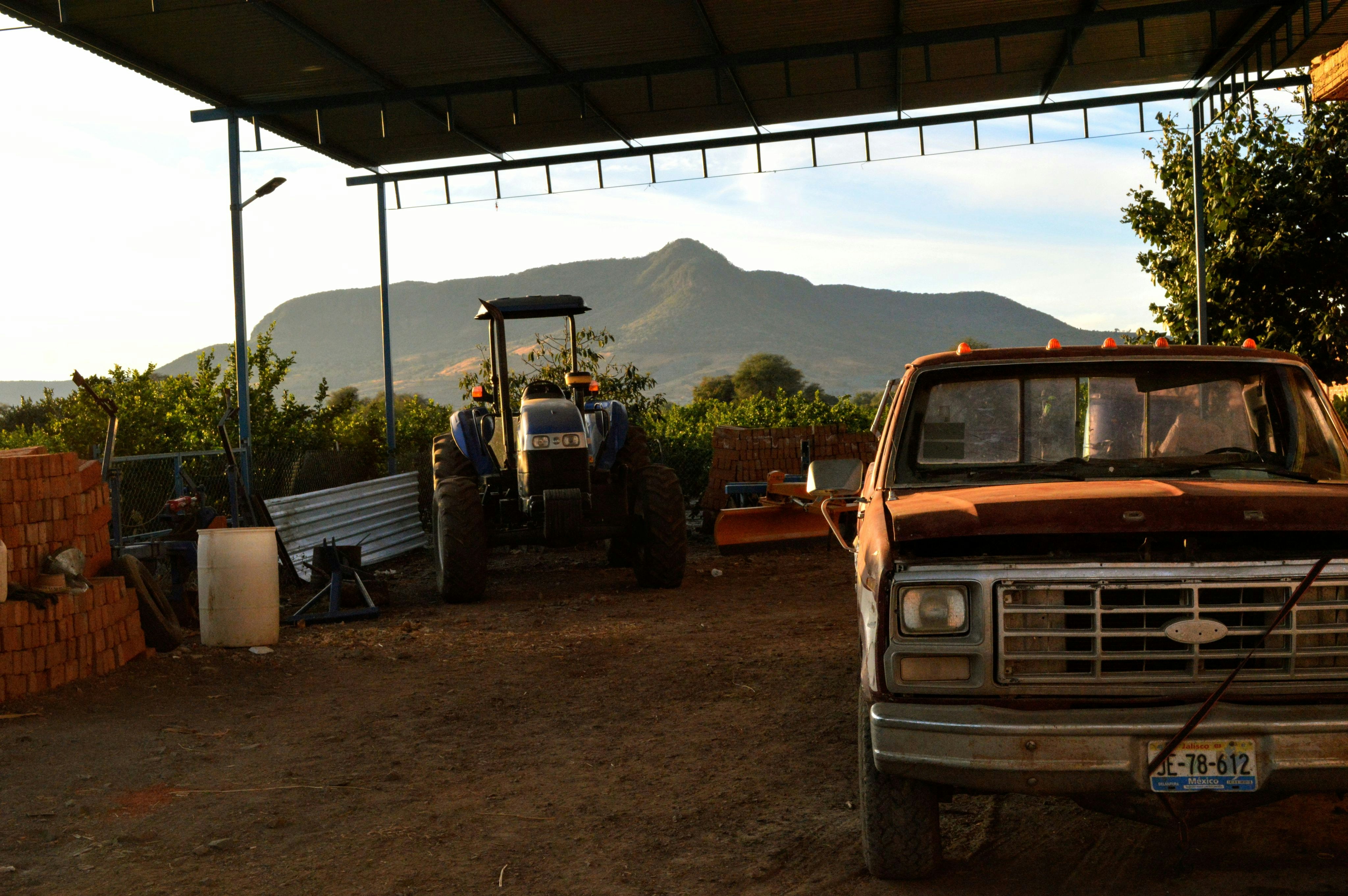 Rustic Machinery Against a Mountain Backdrop