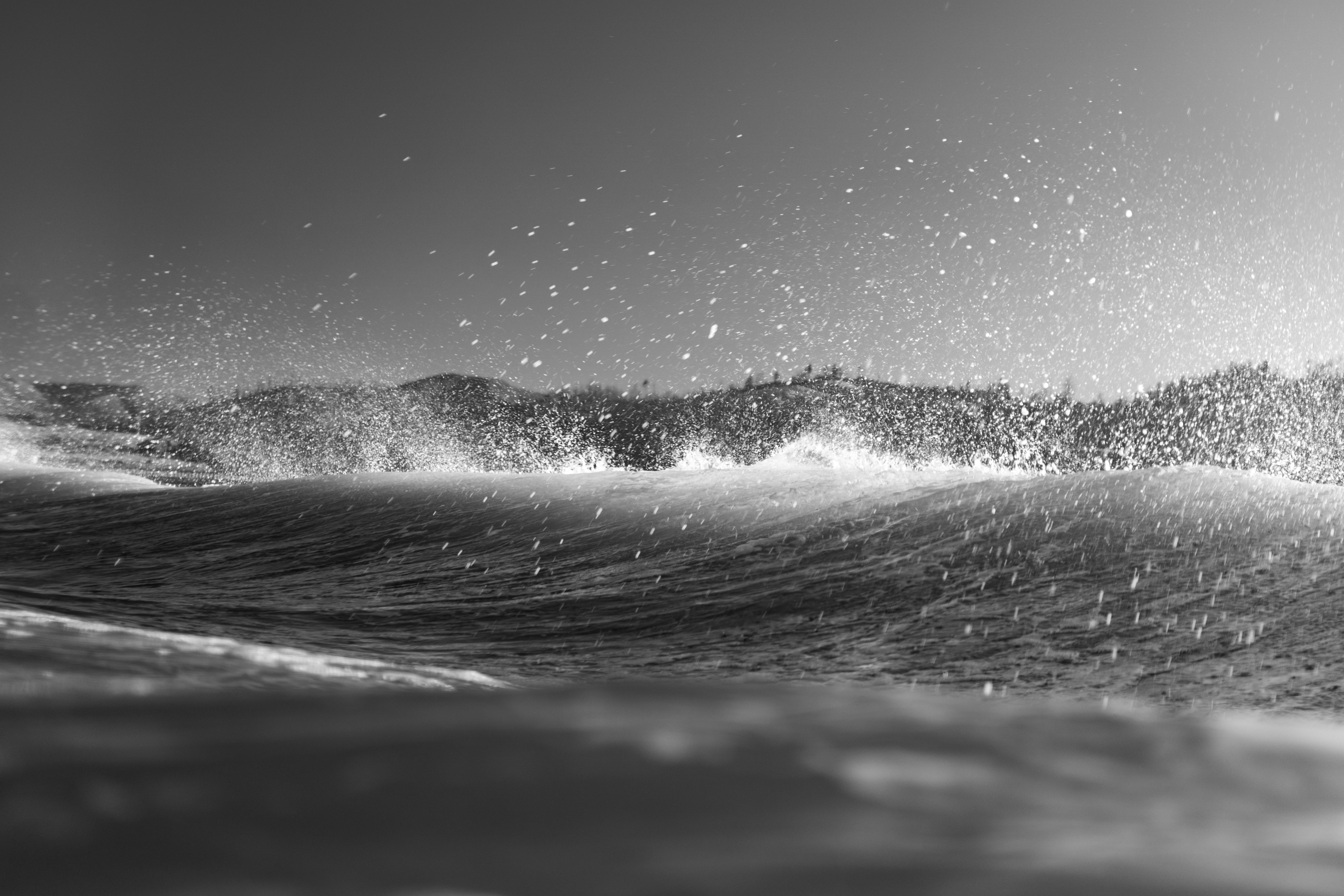 Ocean wave crashing with spray in black and white photo – Free Energy ...