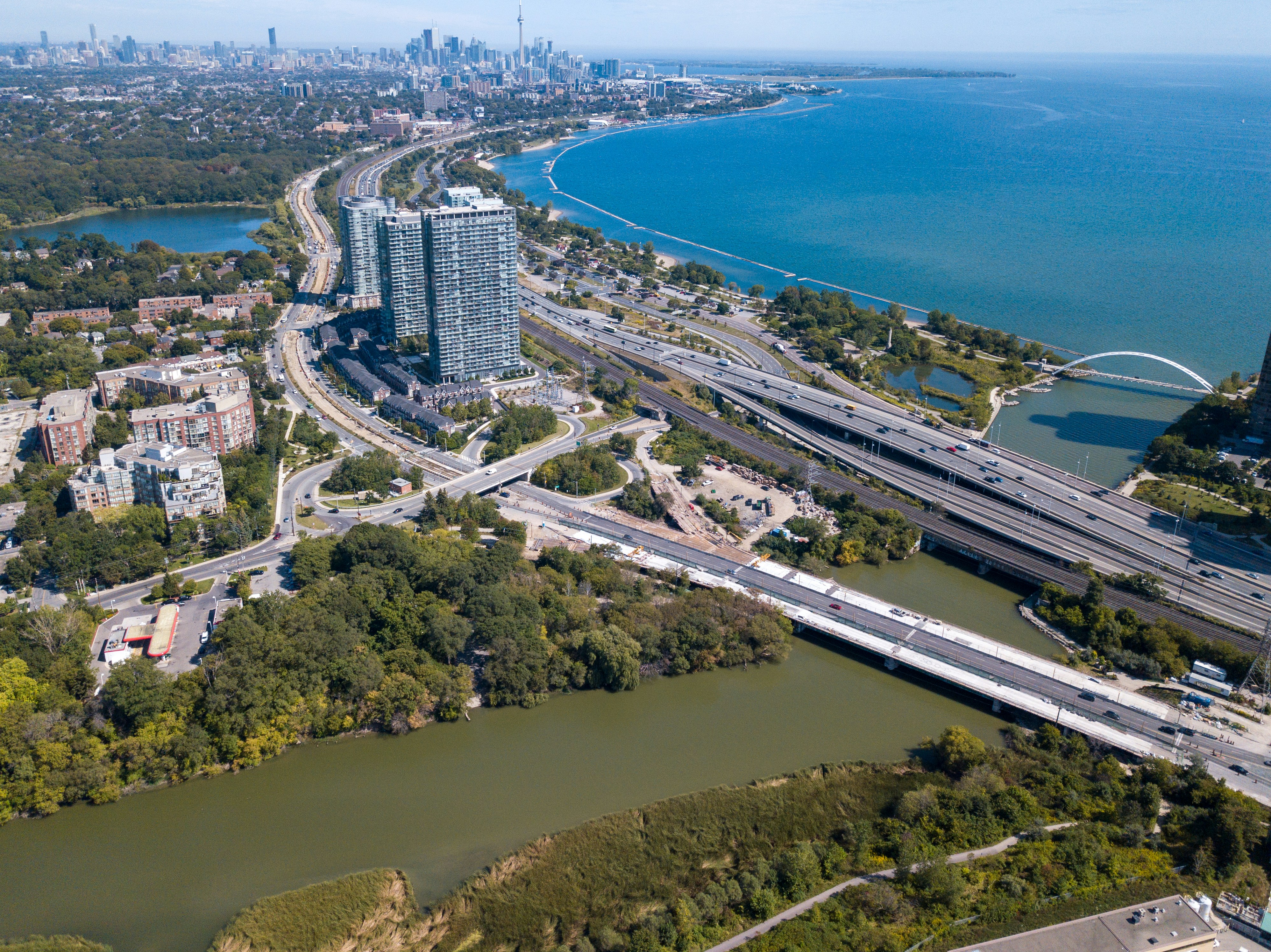 Aerial Drone Photo of the mouth of the Humber River and the Humber River Arch Bridge | Aerial view of a city skyline along the coast.