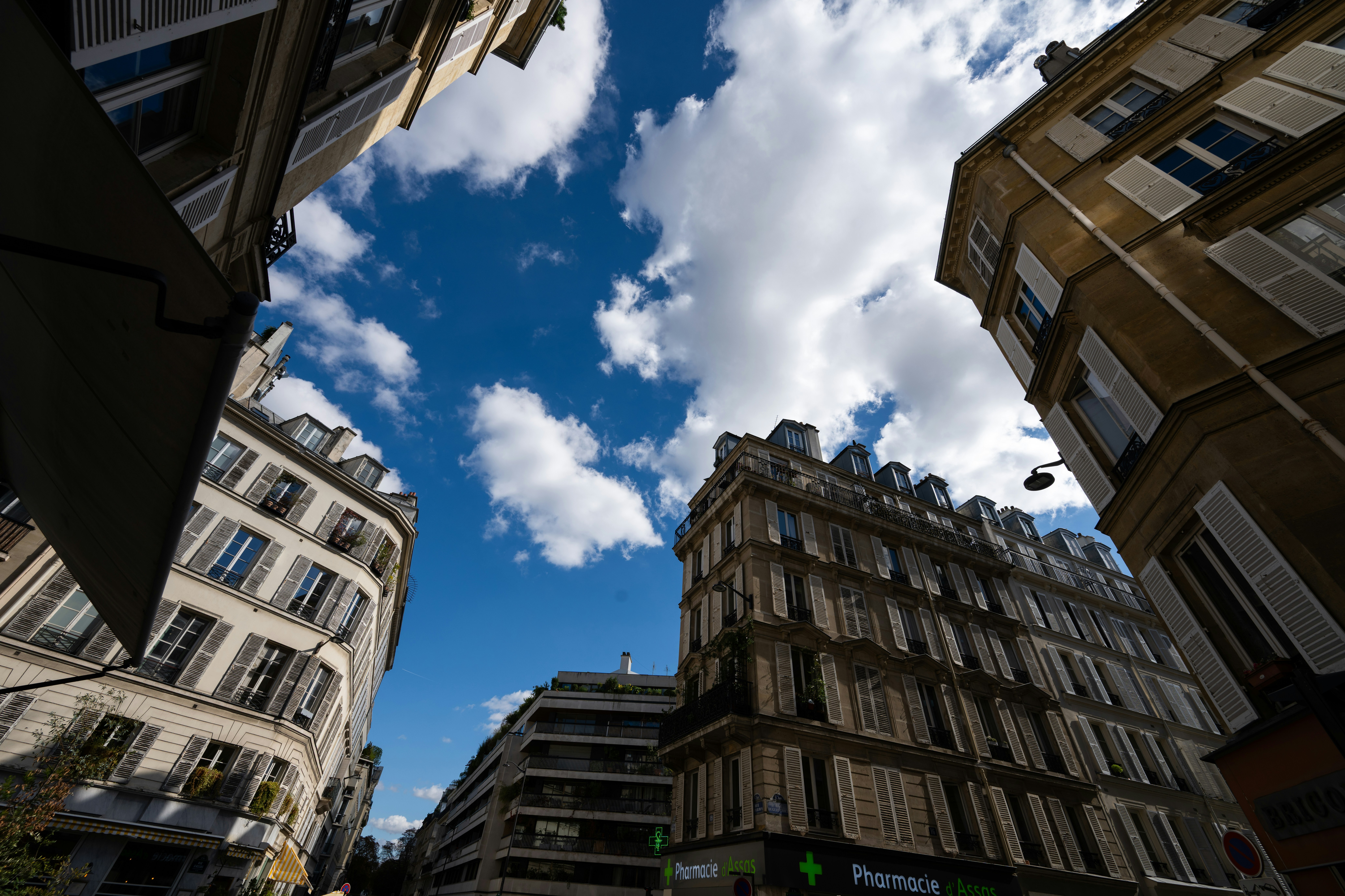 Buildings against a blue sky with clouds