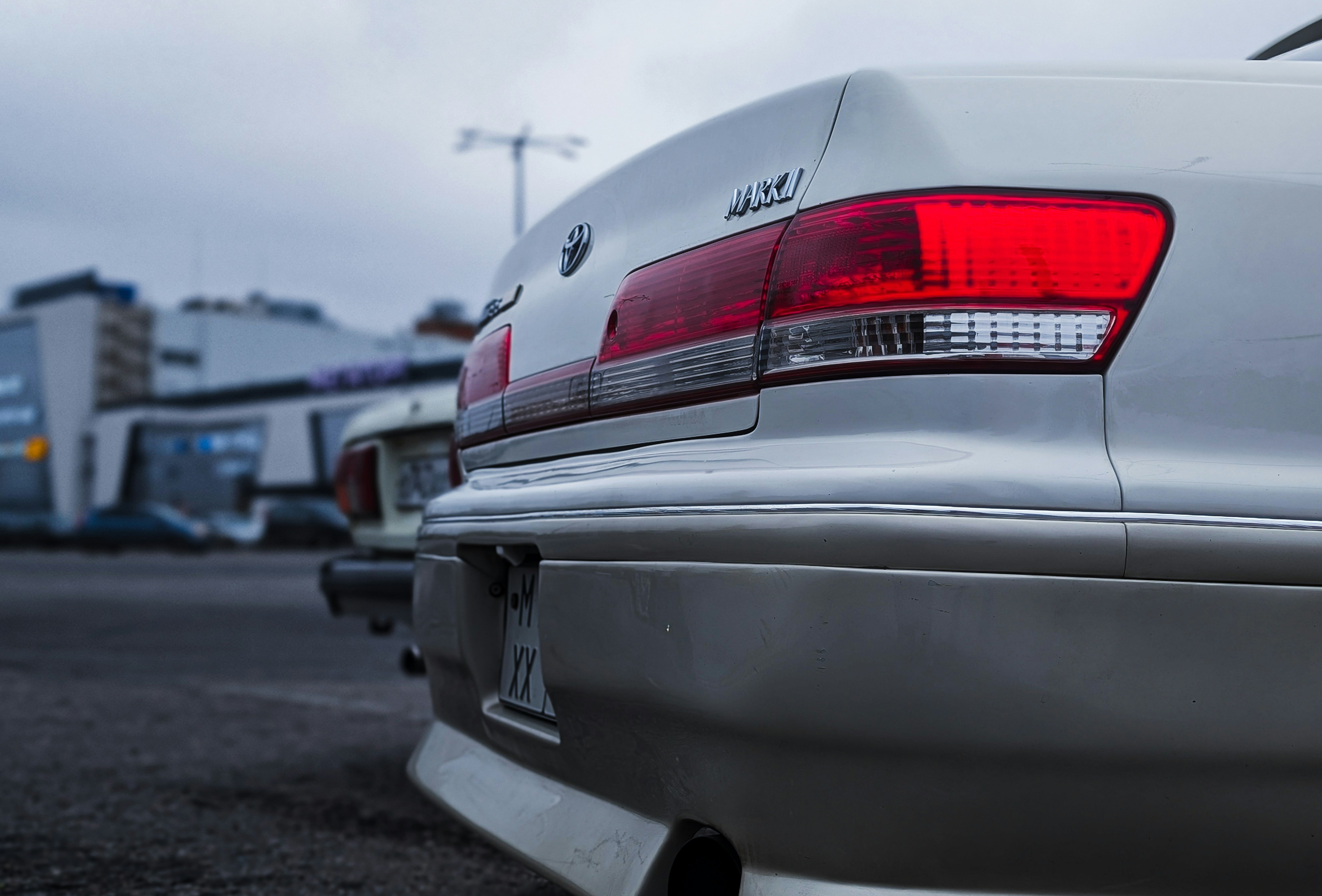 Close-up of a white car's rear taillight