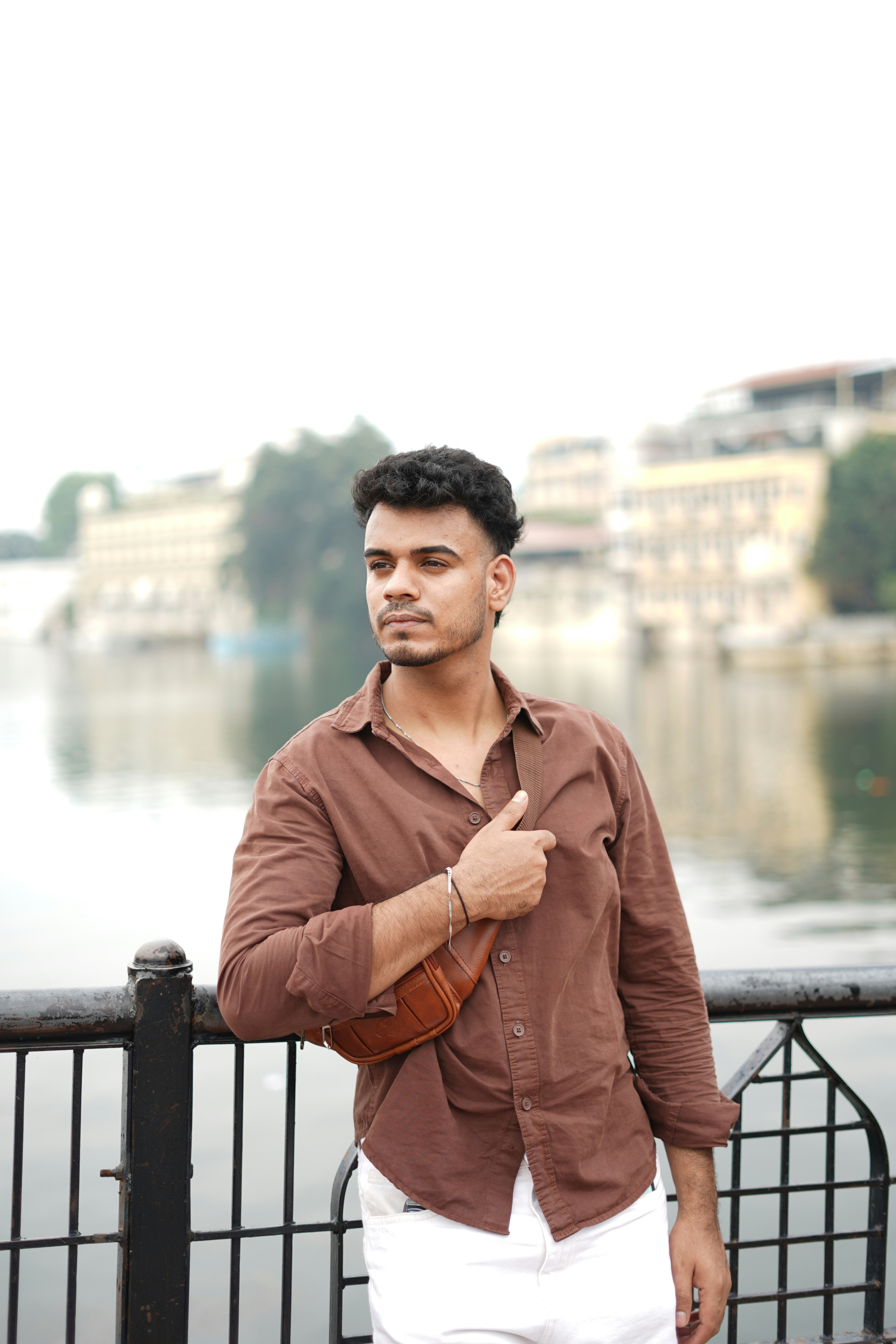 Riverside Gaze: A Quiet Portrait by the Water's Edge