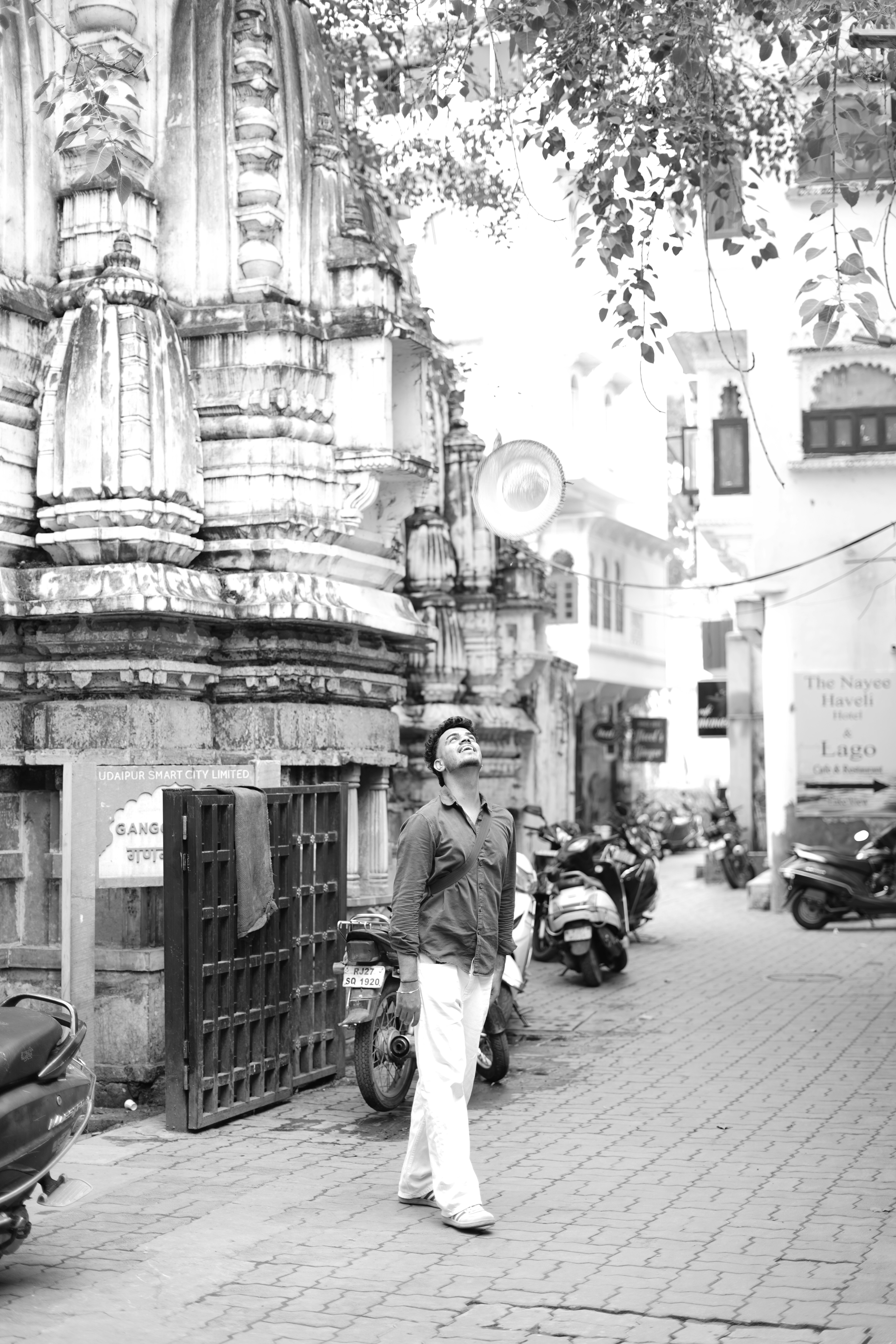 Circular Halo Over a Curious Gaze in a Spire-Lined Street