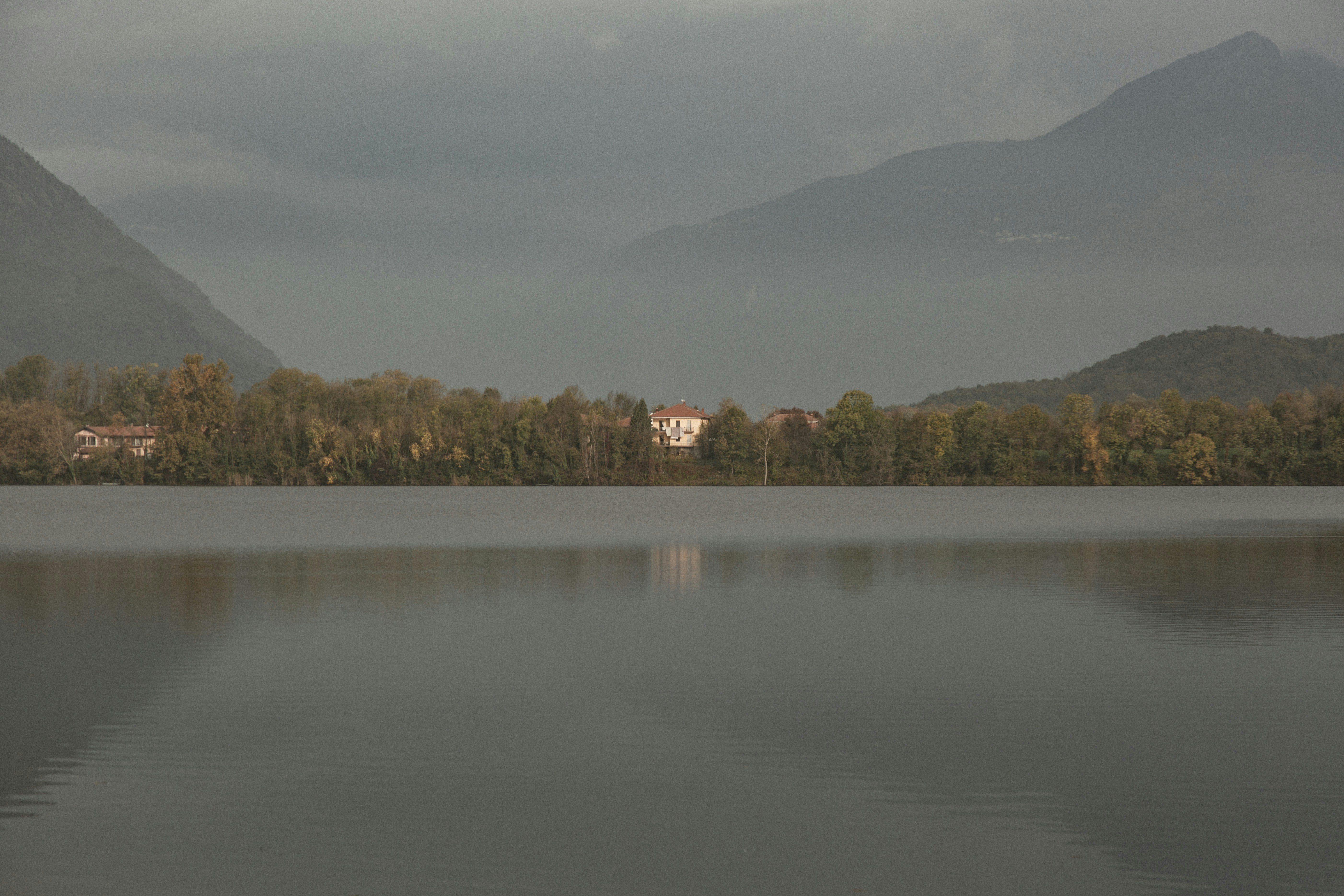 Hello =) Follow my journey on insta: I_am_simoesse | Calm lake with trees and mountains under cloudy sky