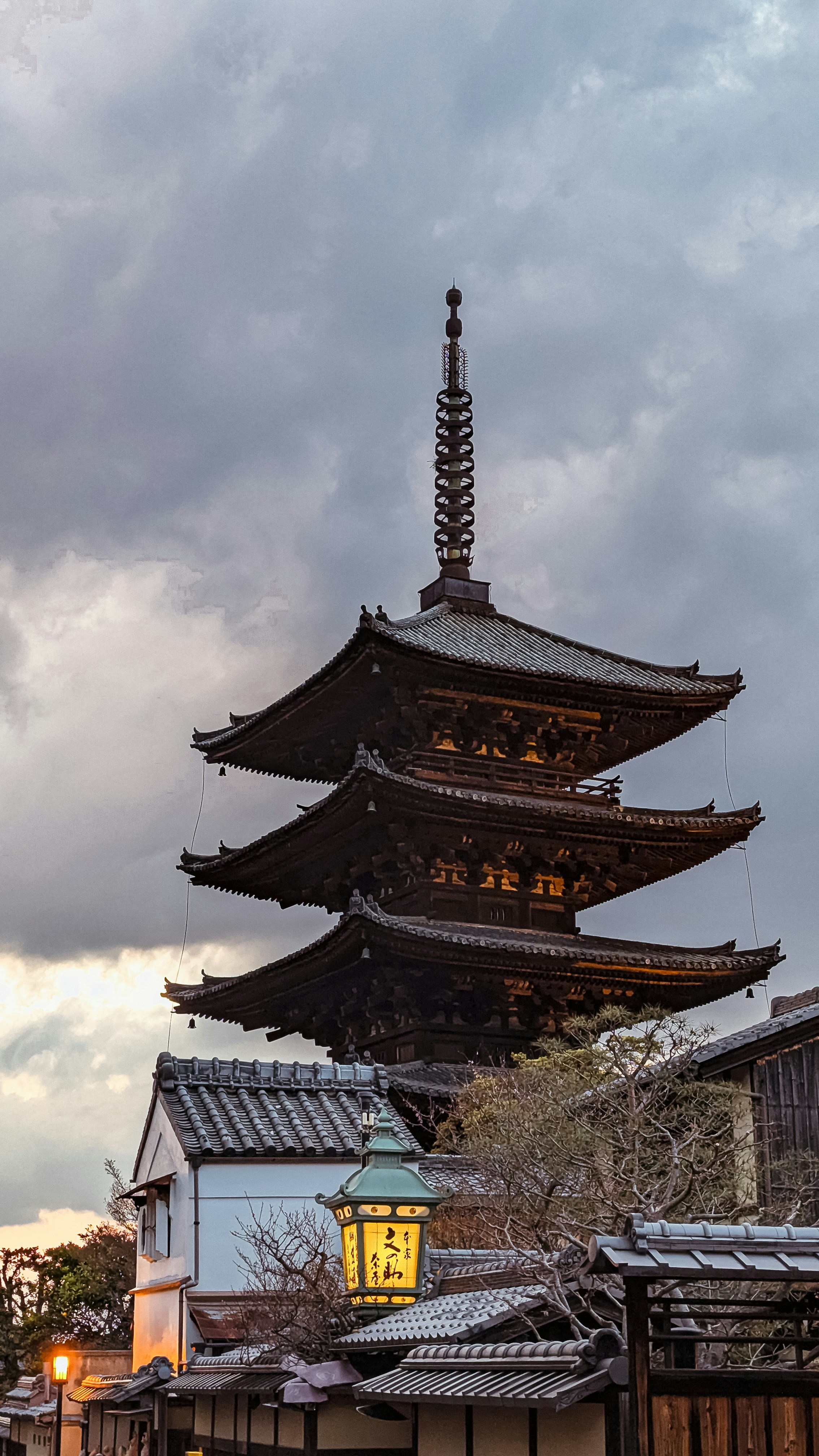 Three-Tiered Echoes Under a Tempest Sky: A Kyoto Pagoda at Dusk