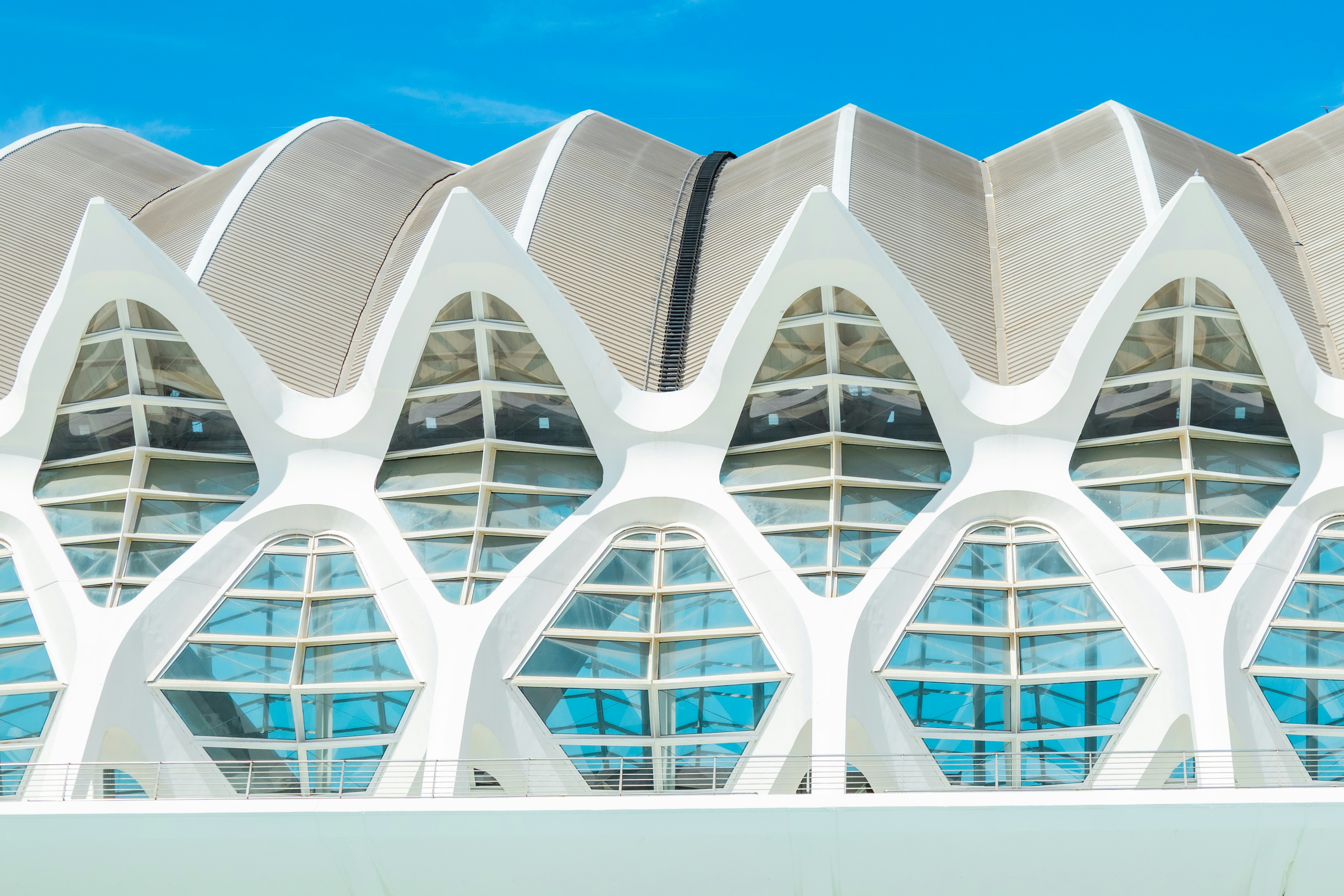 Modern white building with repeating arched windows