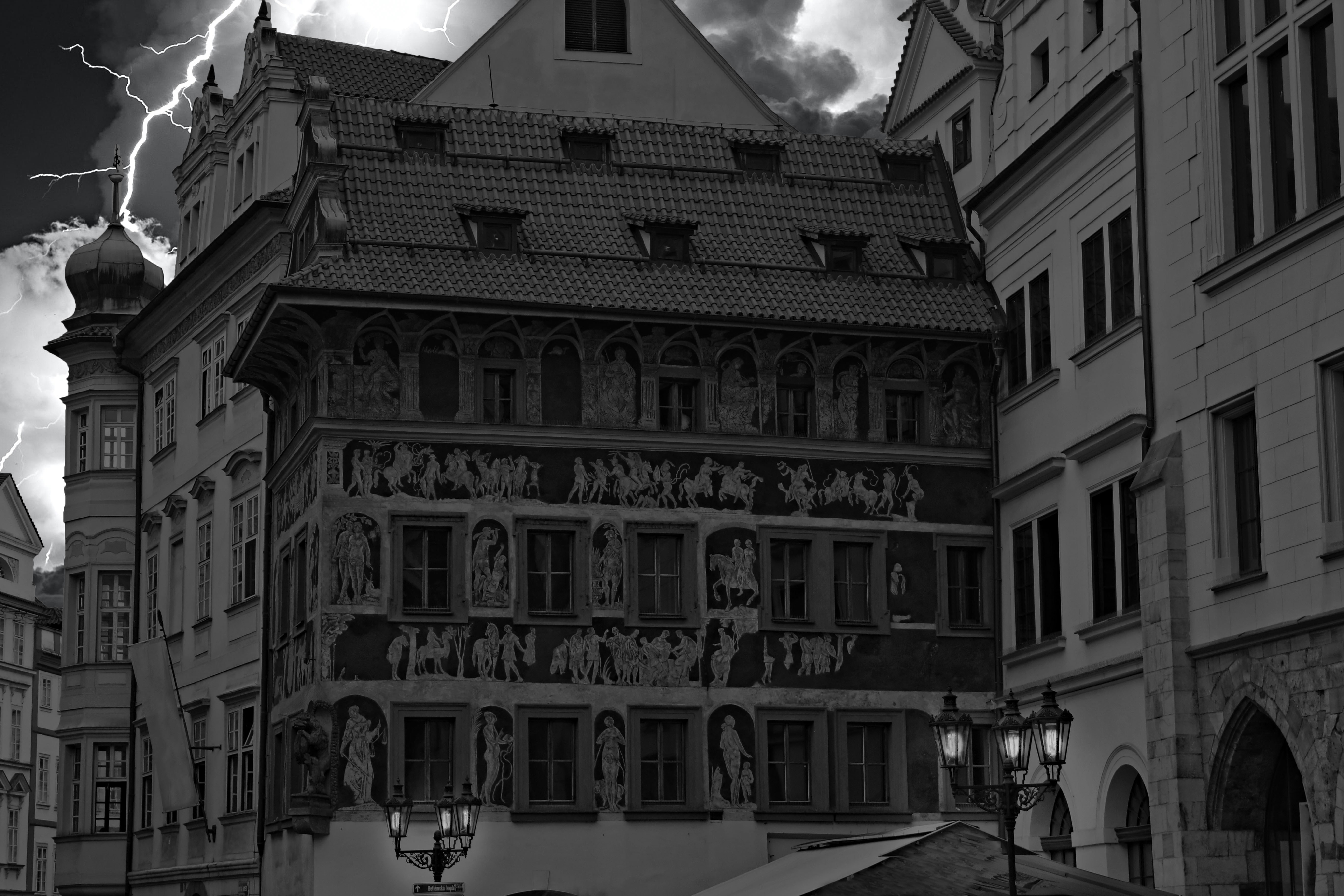 Historic building adorned with intricate frescoes, set against a dramatic stormy backdrop with lightning. The architecture reflects a rich cultural narrative.