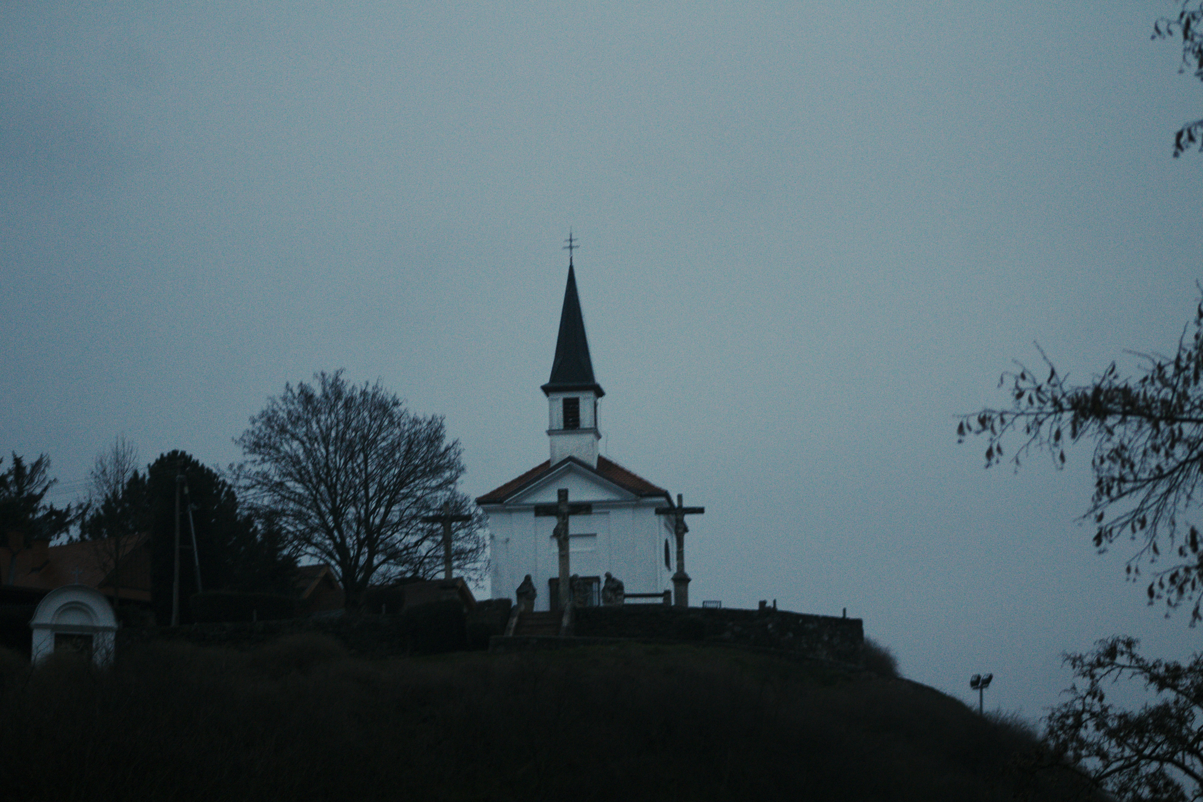 White church with steeple on a hill