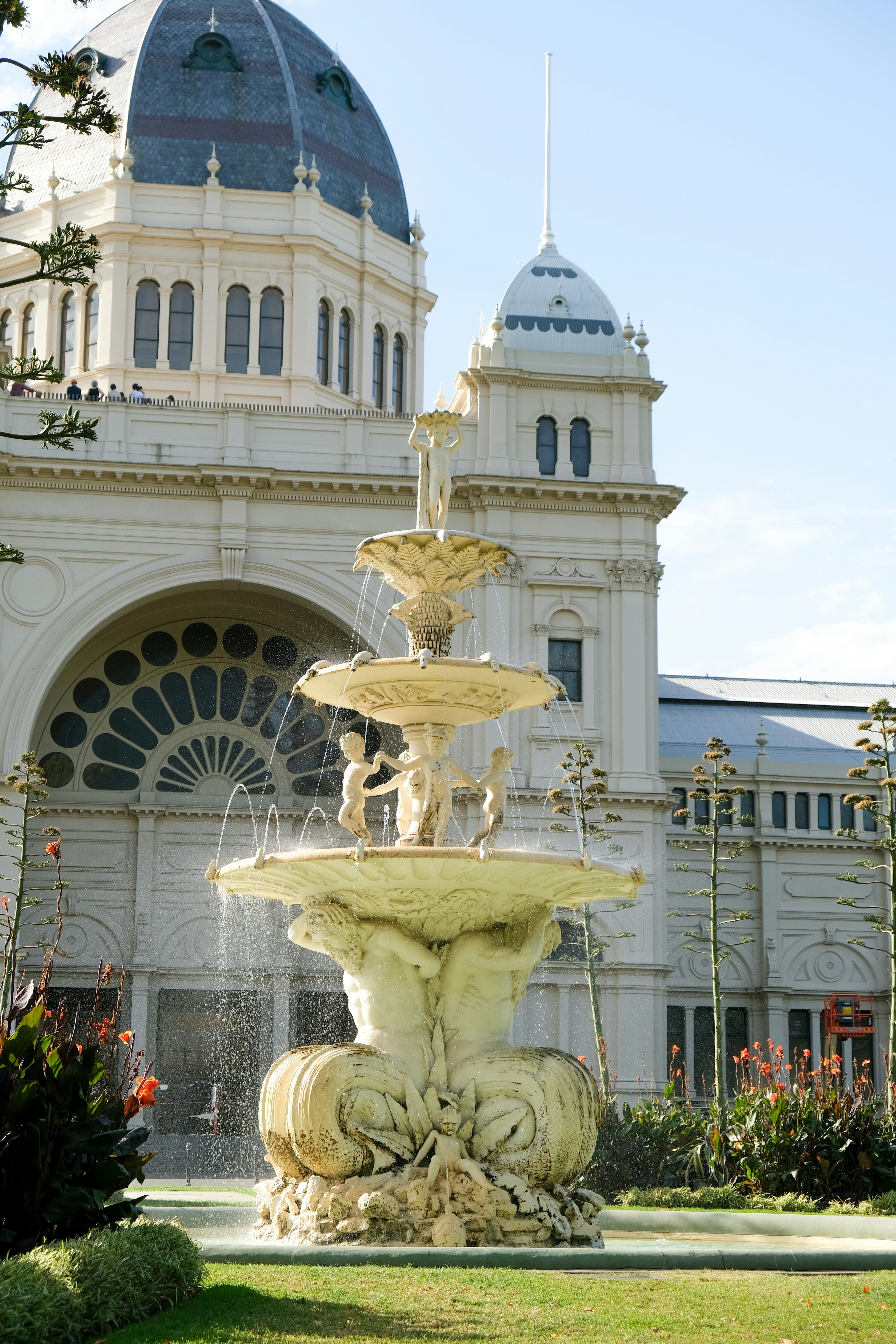 Ornate fountain in front of grand building