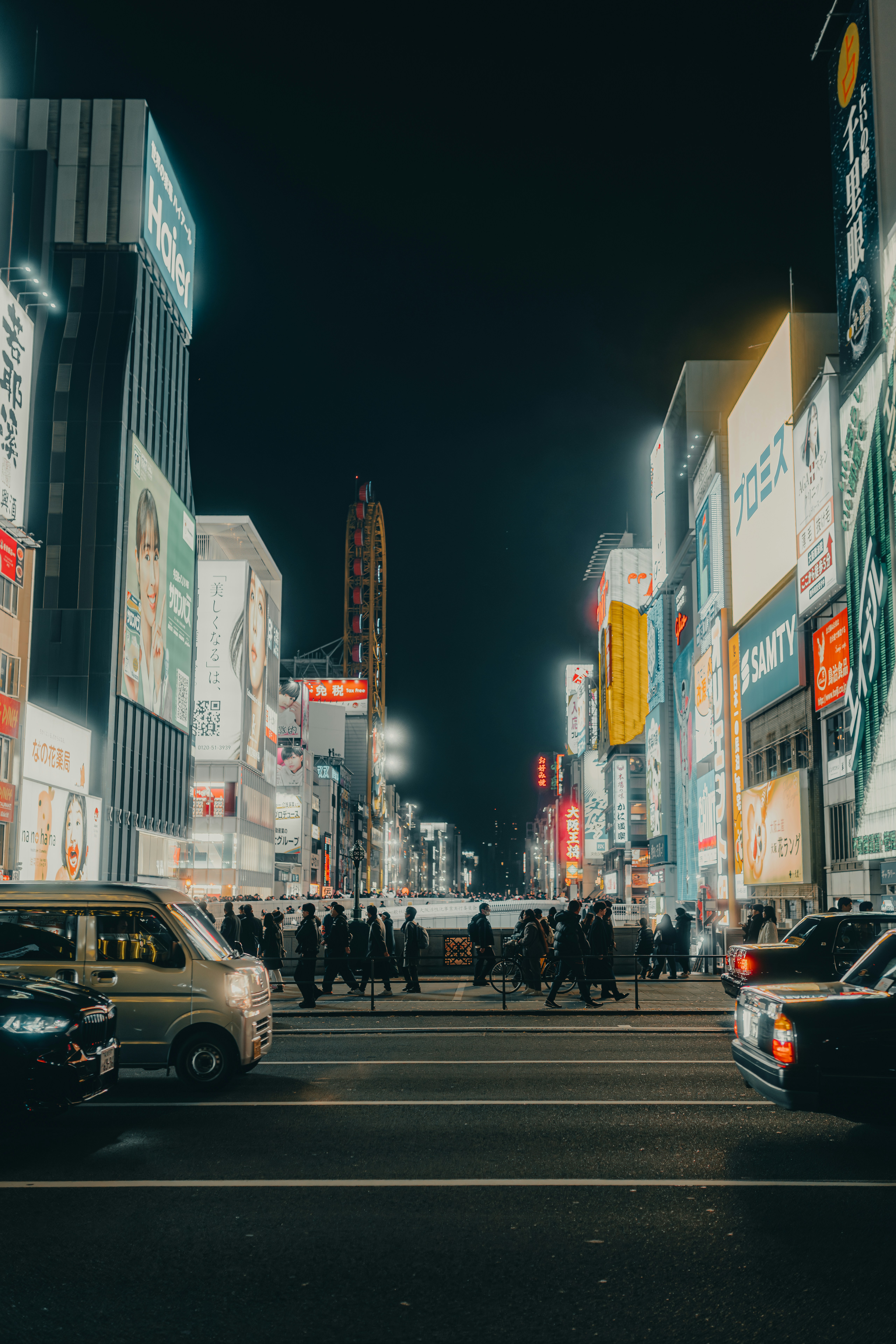 Ig @sir.simo | Busy city street at night with neon signs