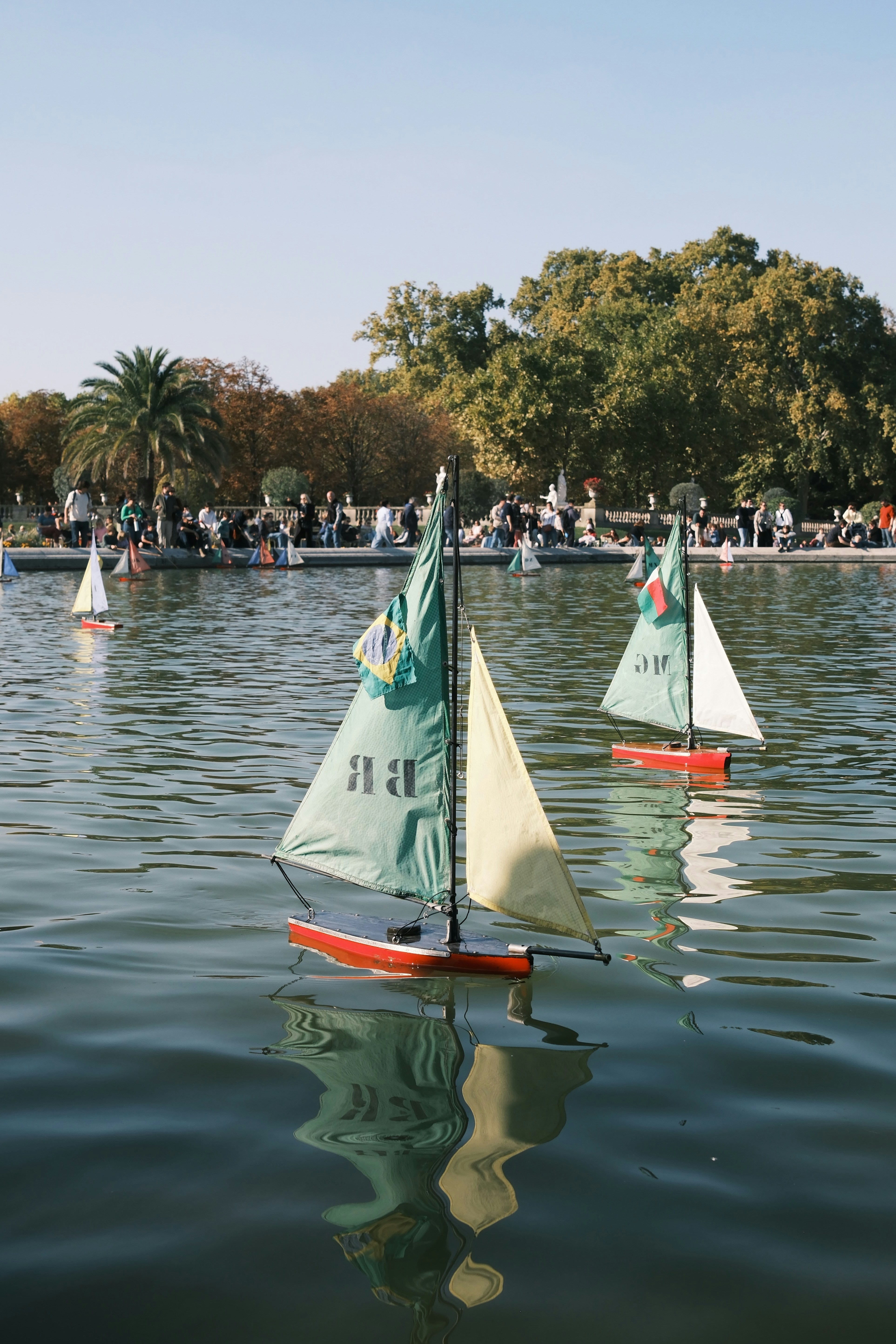 Regatta of Dreams: Miniature Sailboats Dance on Water