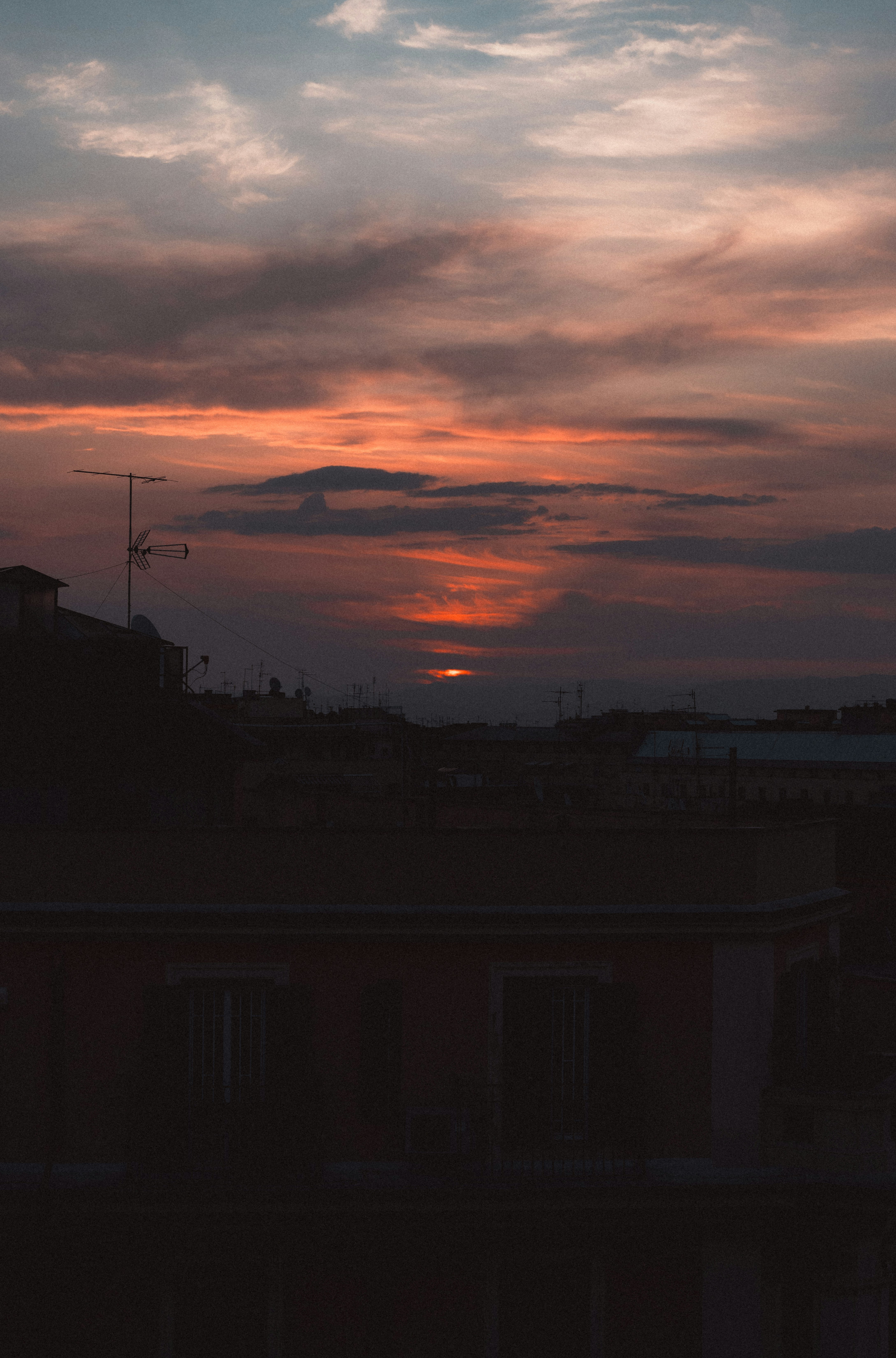Twilight's Embrace Over Urban Rooftops